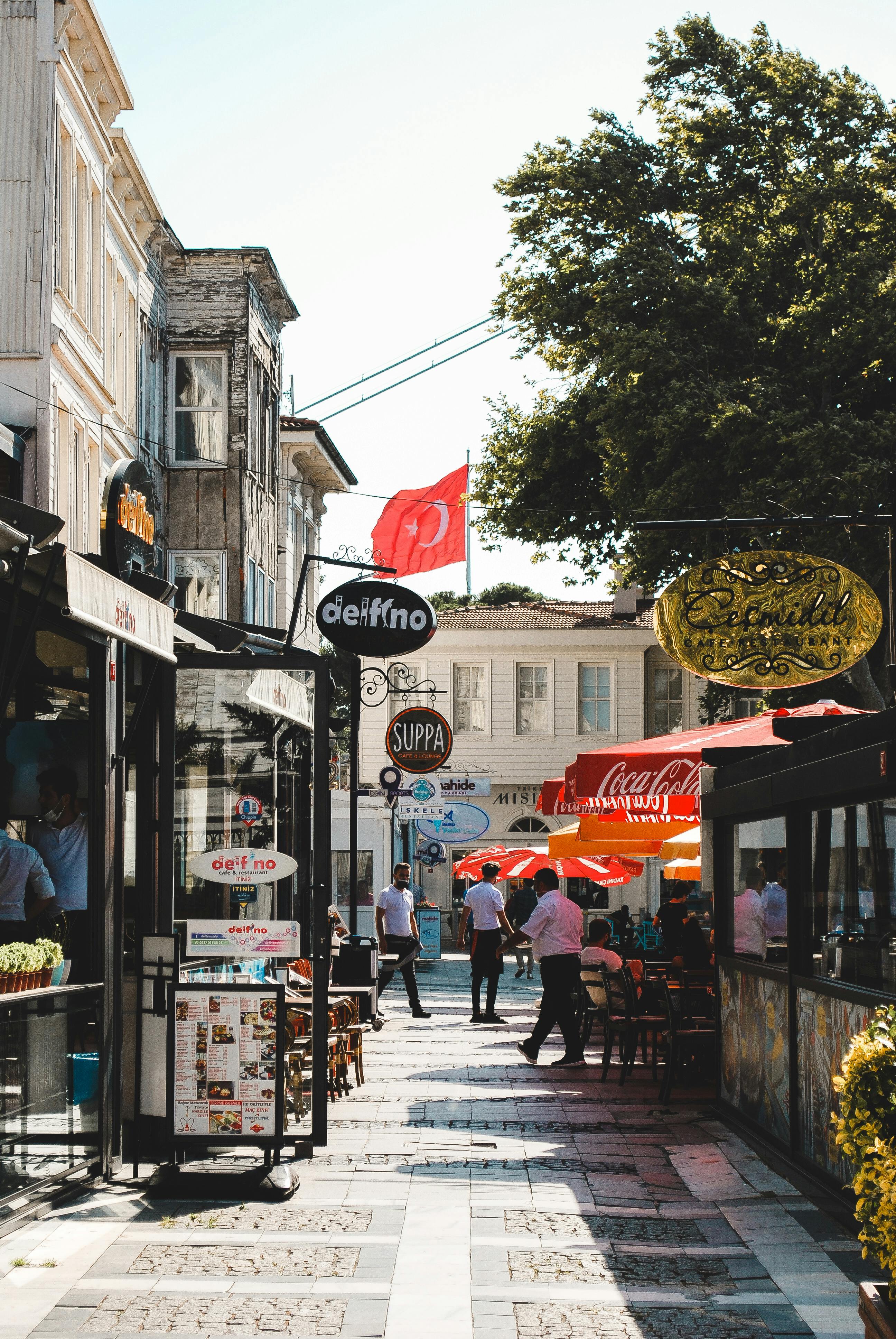 People Walking on Sidewalk Near Store · Free Stock Photo