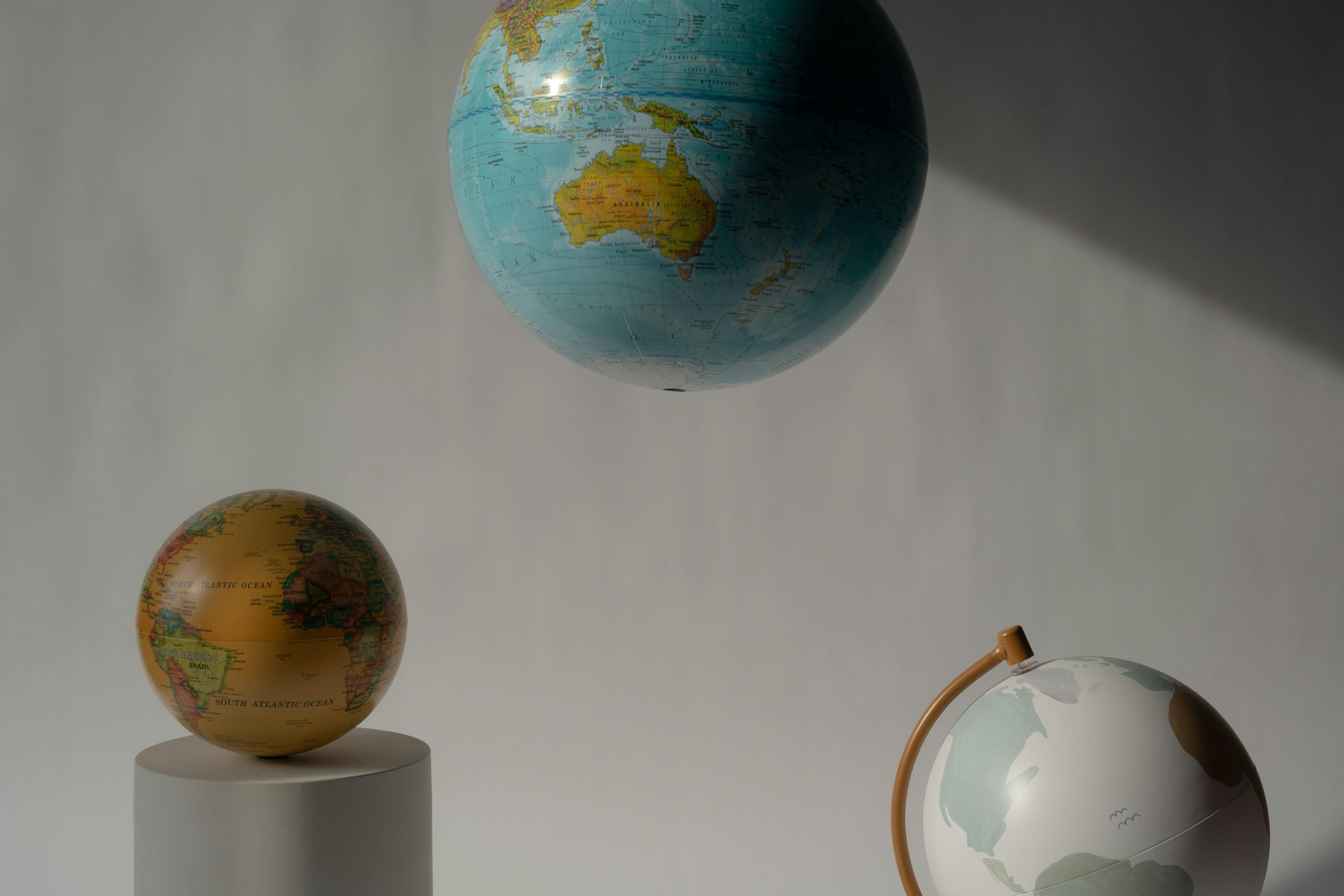 Earth Globes in Studio · Free Stock Photo