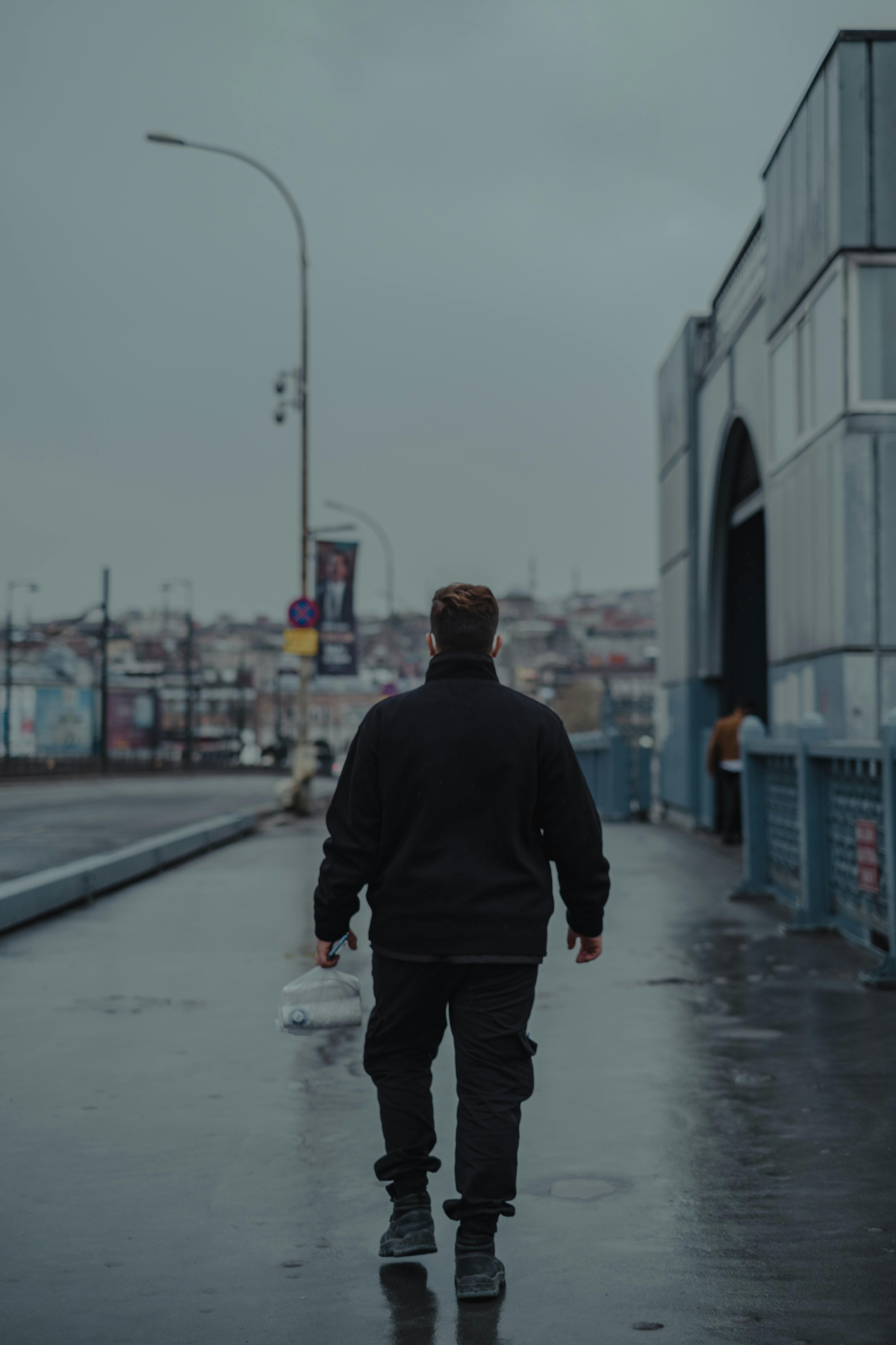 Senior woman using walker for moving alone through snowy pathway · Free ...