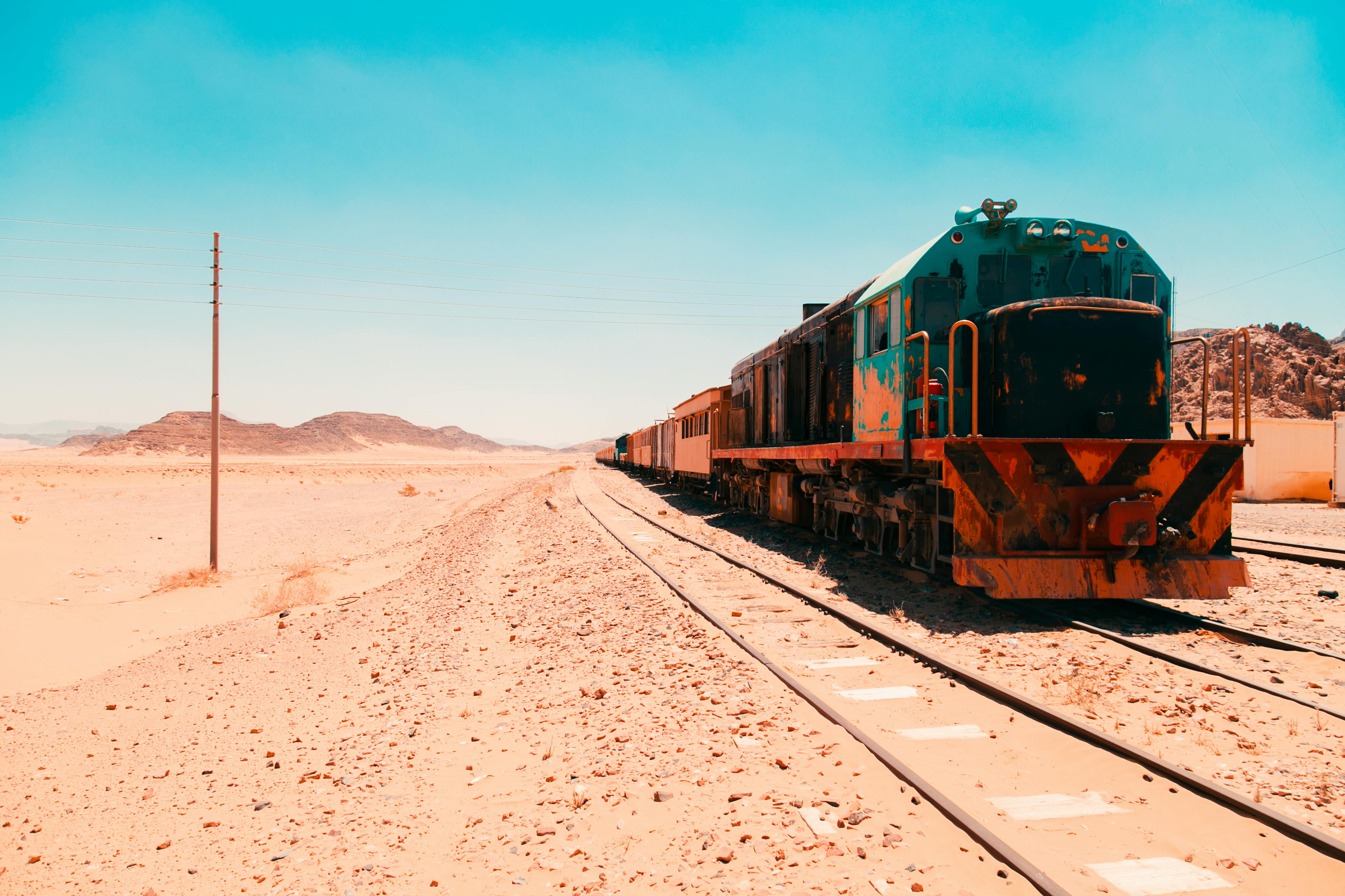 Train on Railroad Parked on Dessert · Free Stock Photo