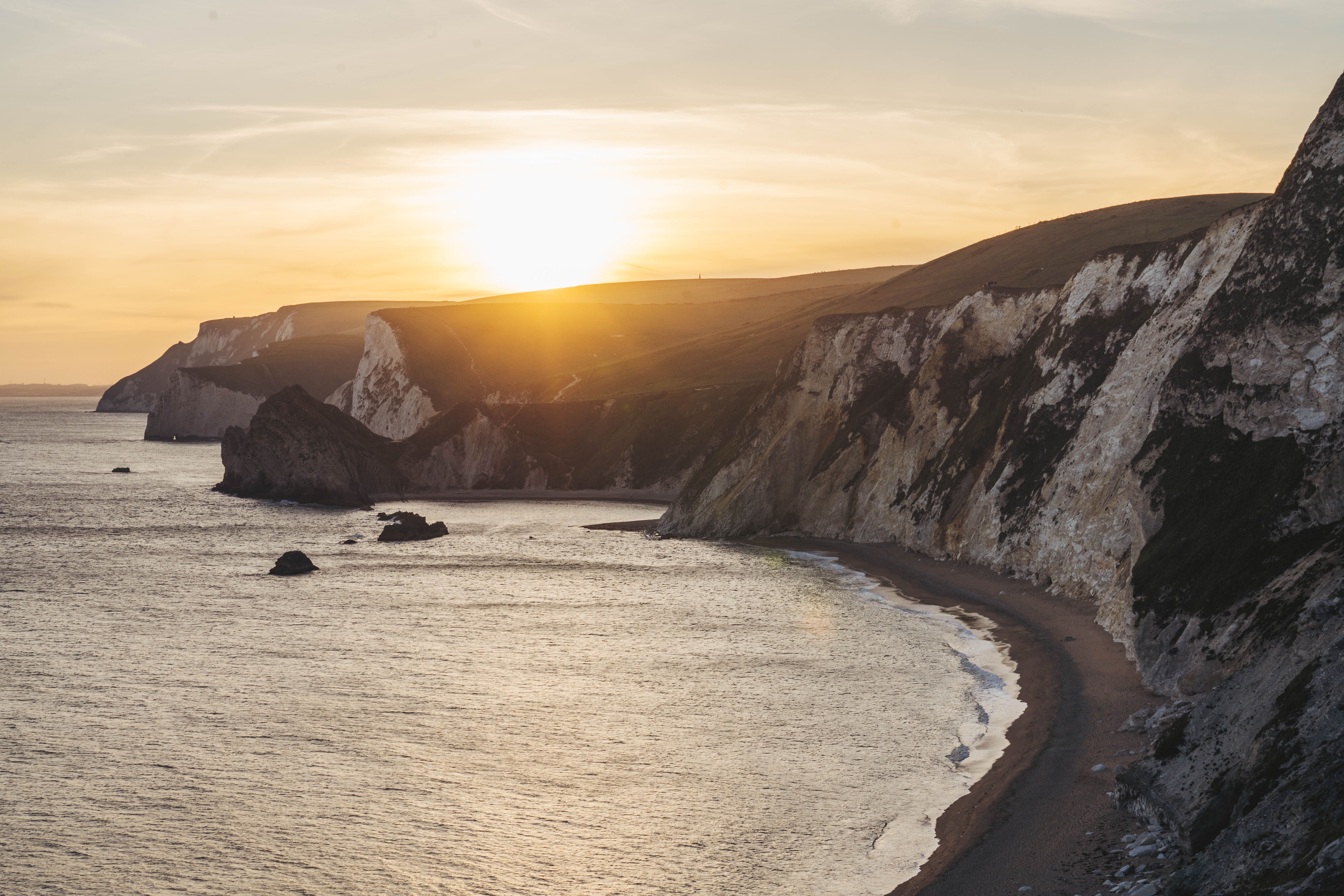 Black Rock Formation near Beach during Sunset · Free Stock Photo