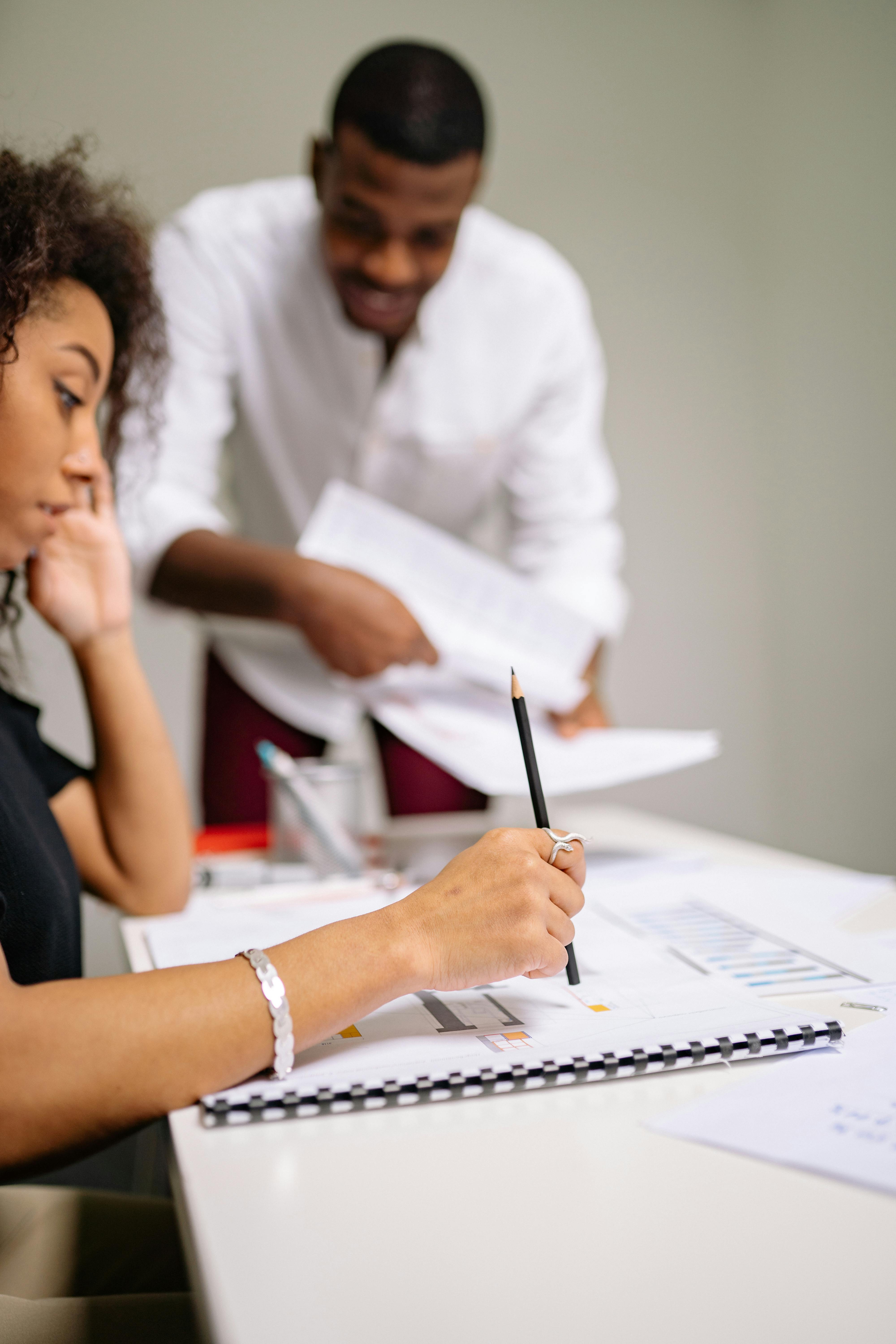 A Woman Thinking in the Office · Free Stock Photo