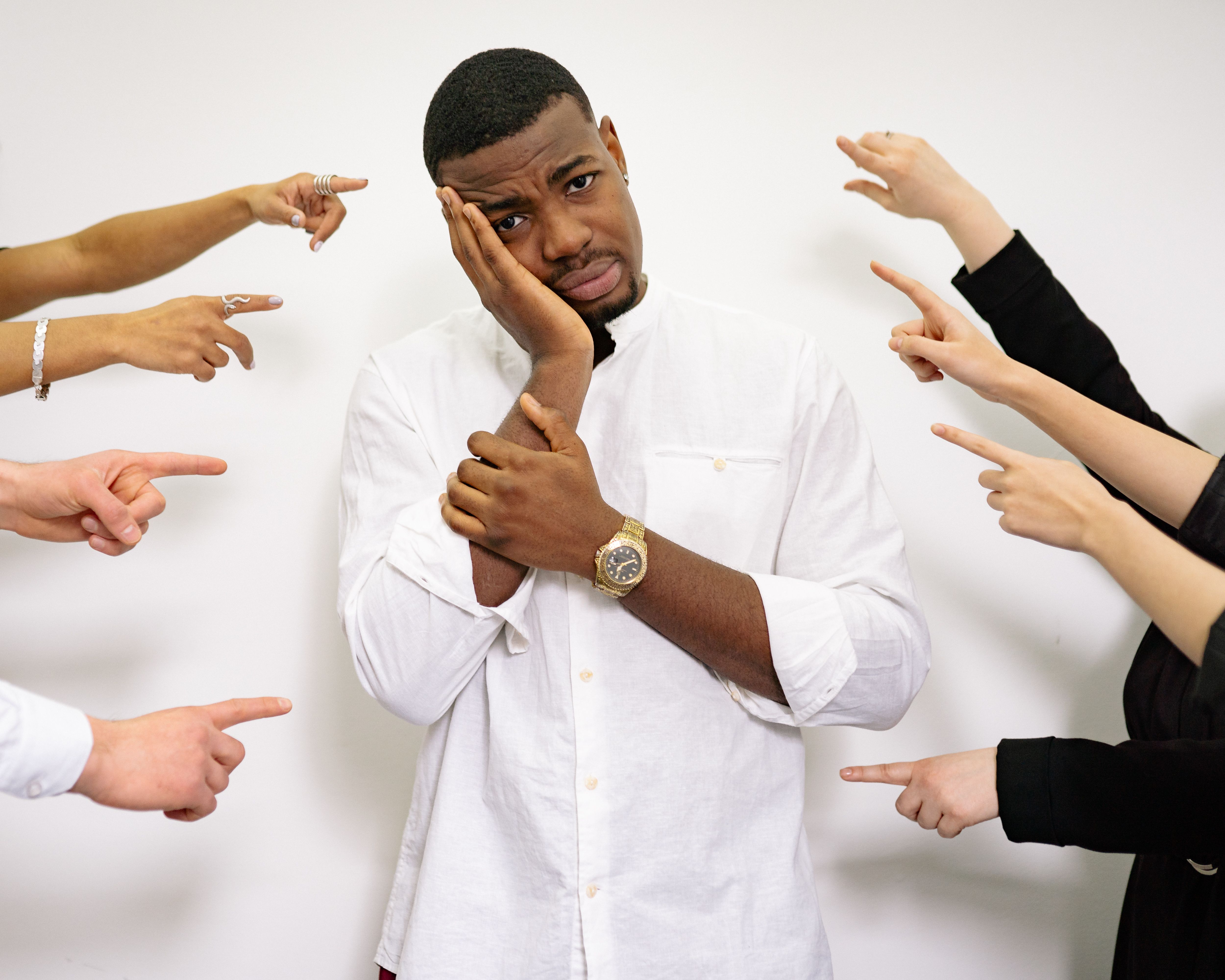 People Ponting on a Man · Free Stock Photo