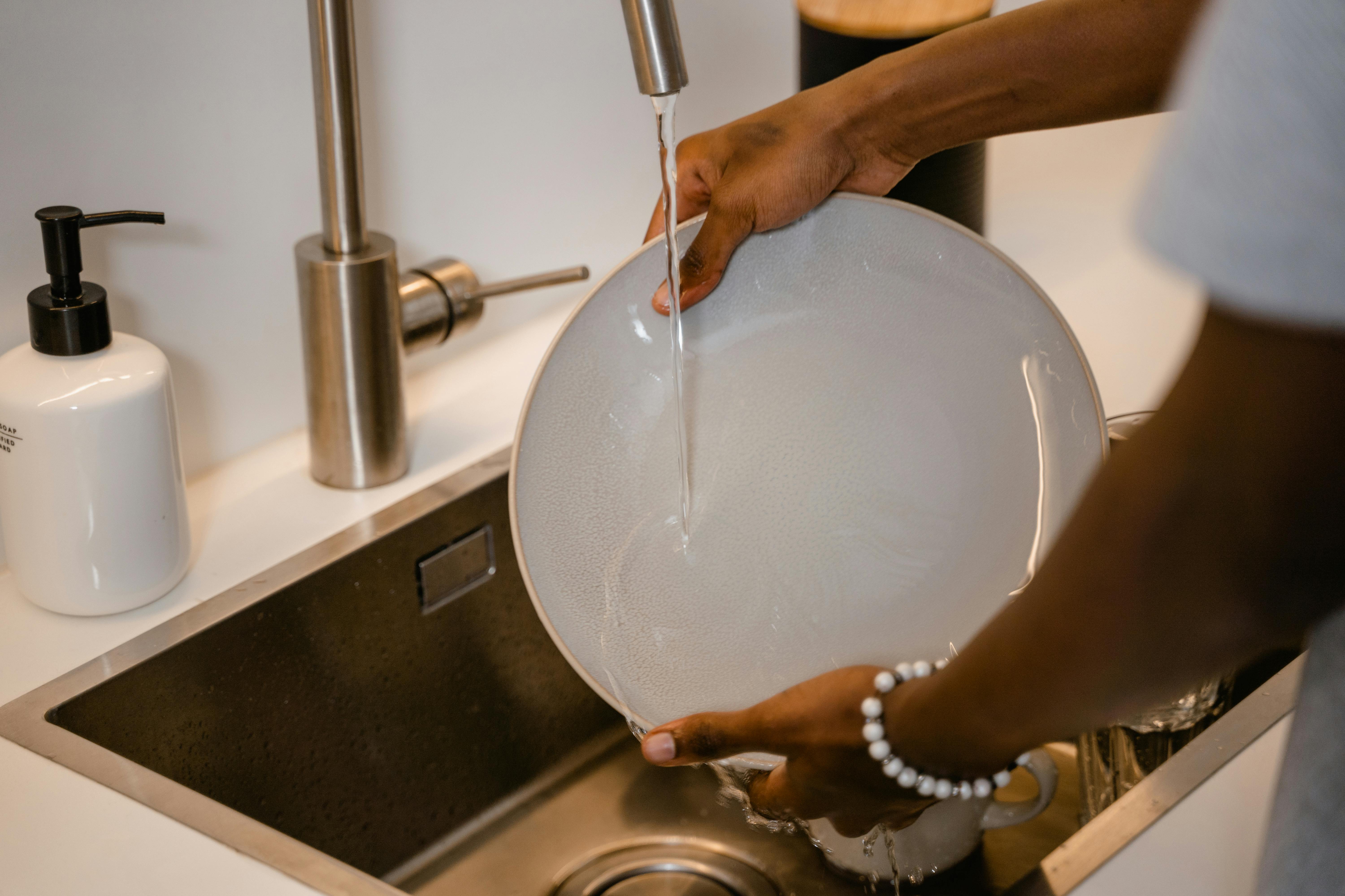 Person Washing Dishes · Free Stock Photo