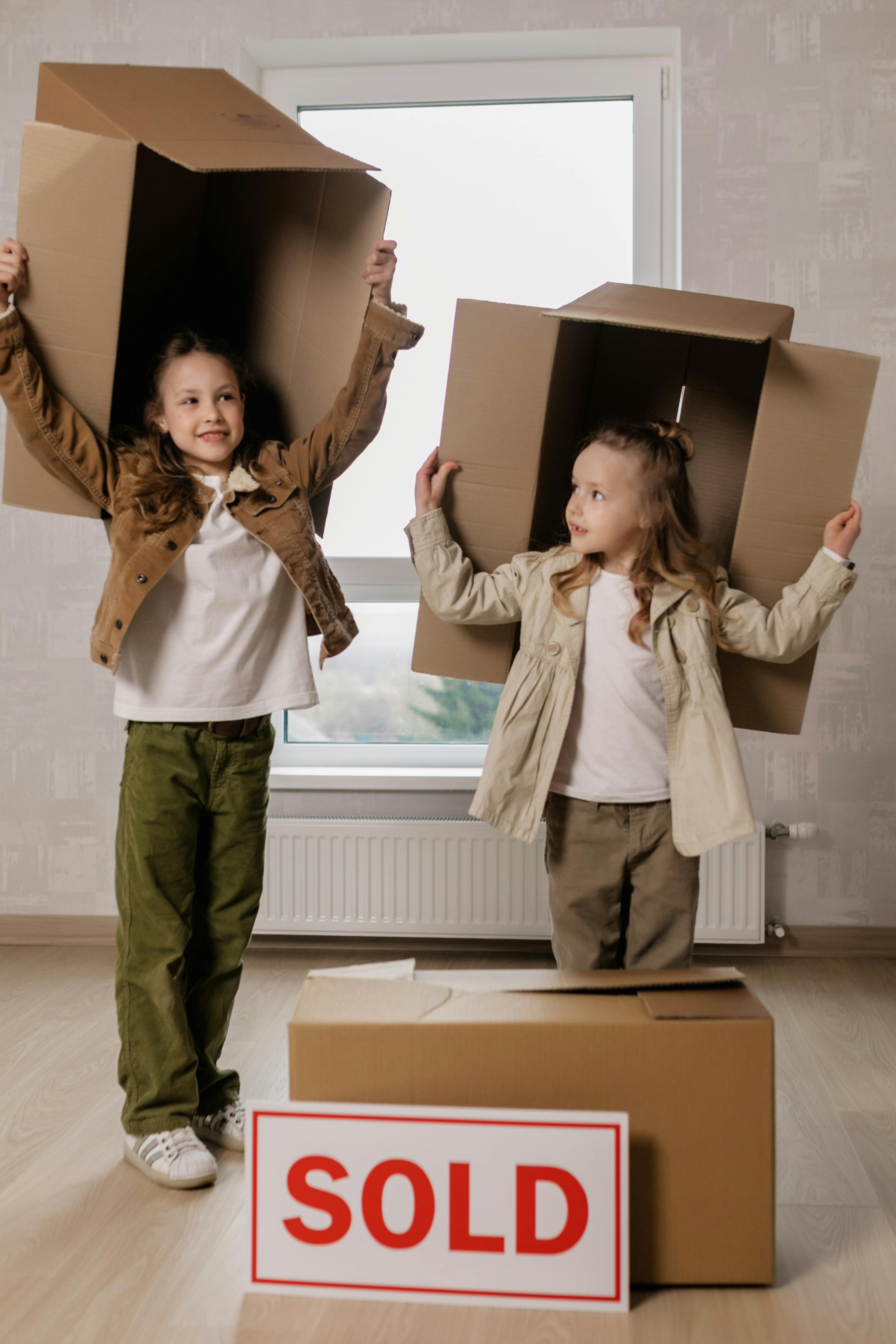 Kids Playing with Cardboard Boxes · Free Stock Photo