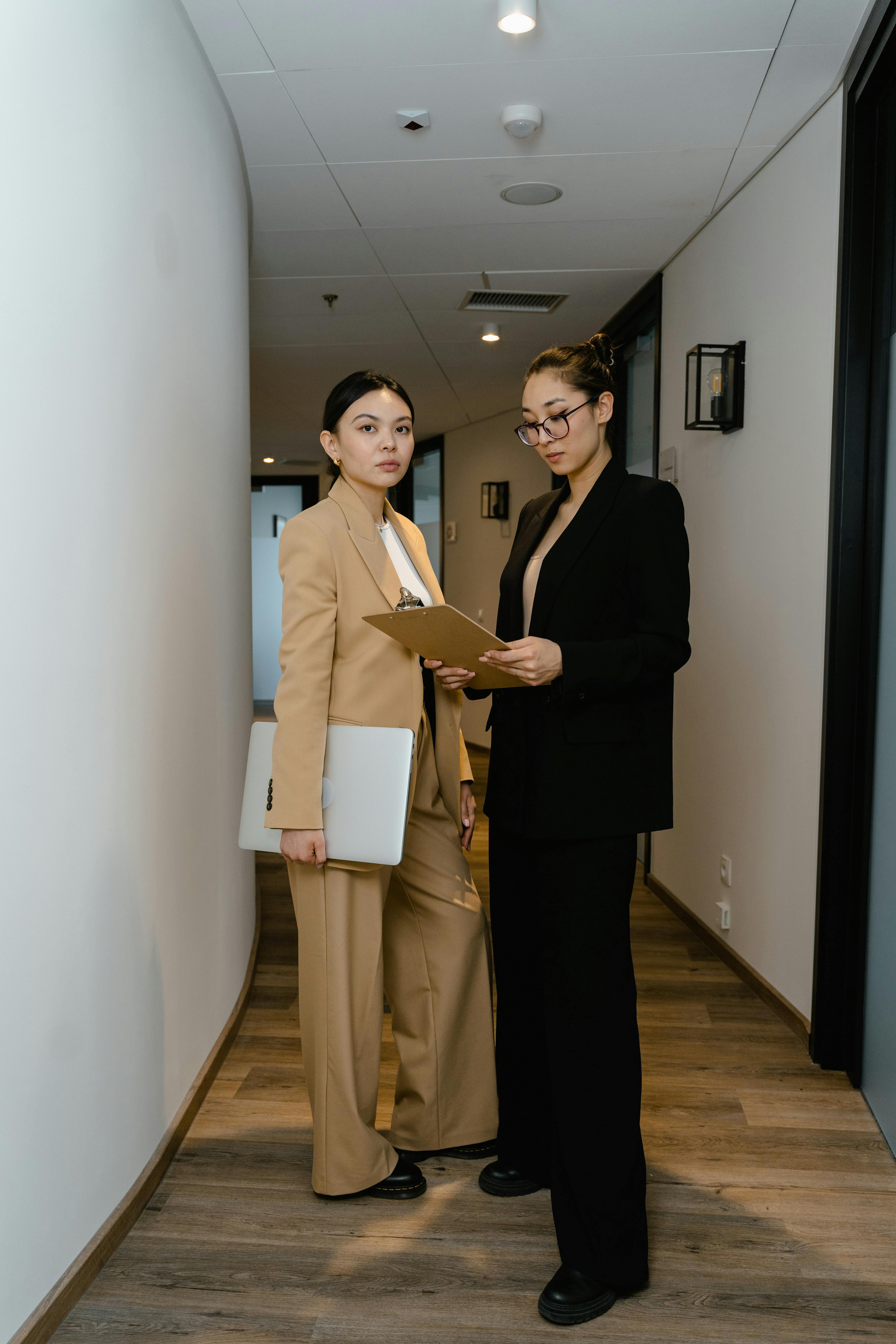 A Female Wearing Formal Clothing, Looking at Camera in an Office · Free ...