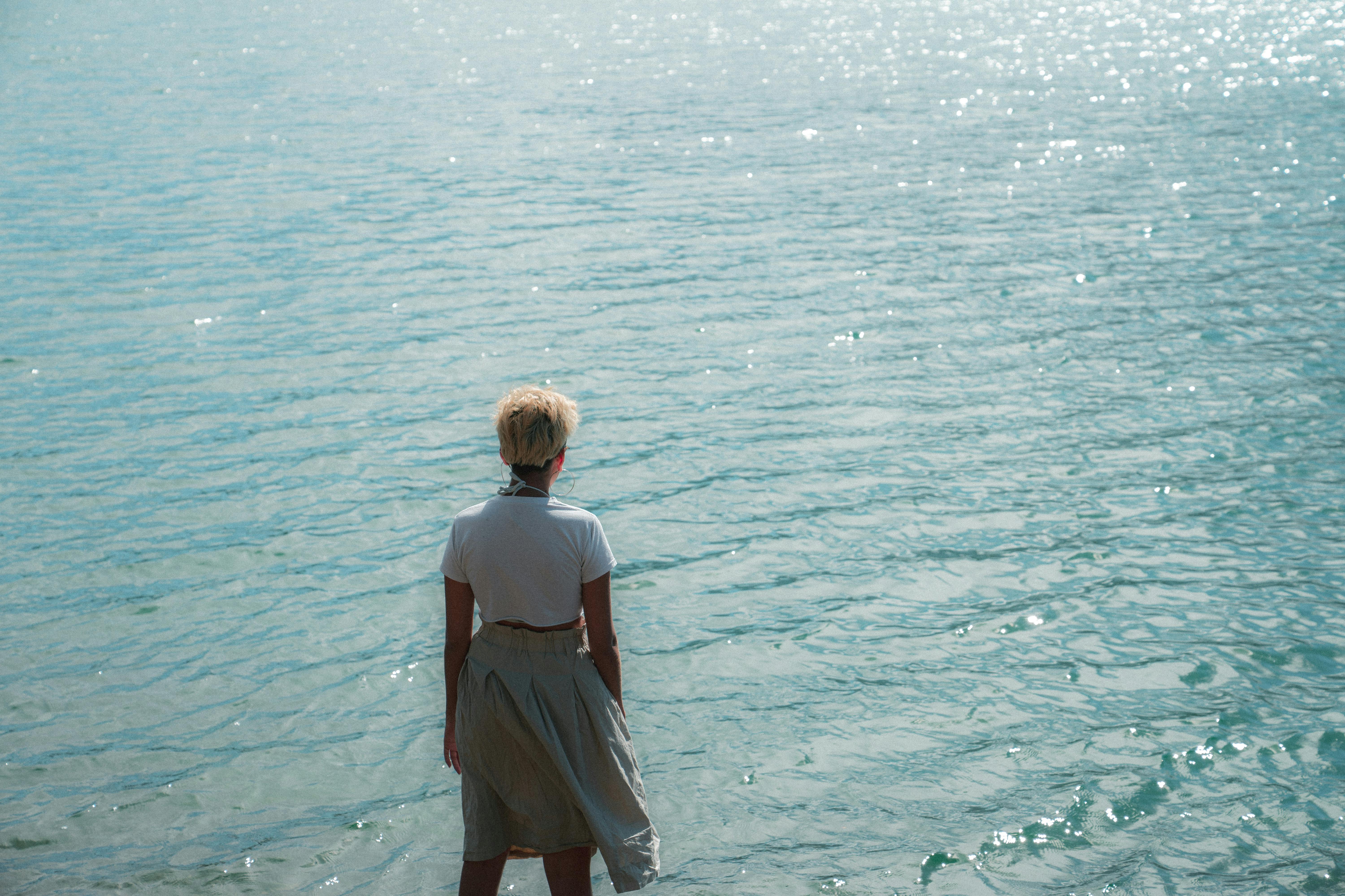 Photo of a Woman Swimming in Body of Water · Free Stock Photo