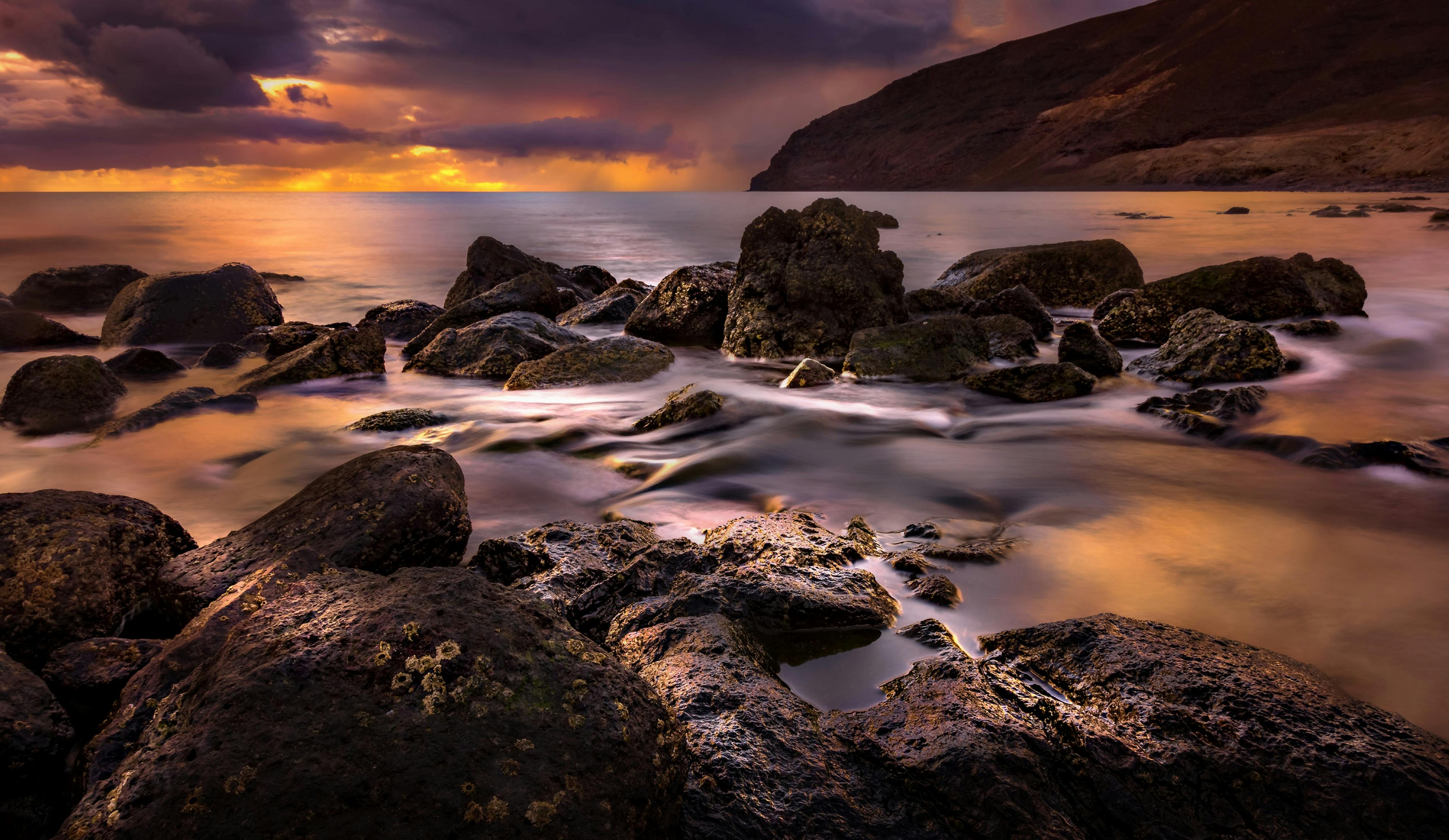 Boulders of Rocks on the Sea Shore · Free Stock Photo