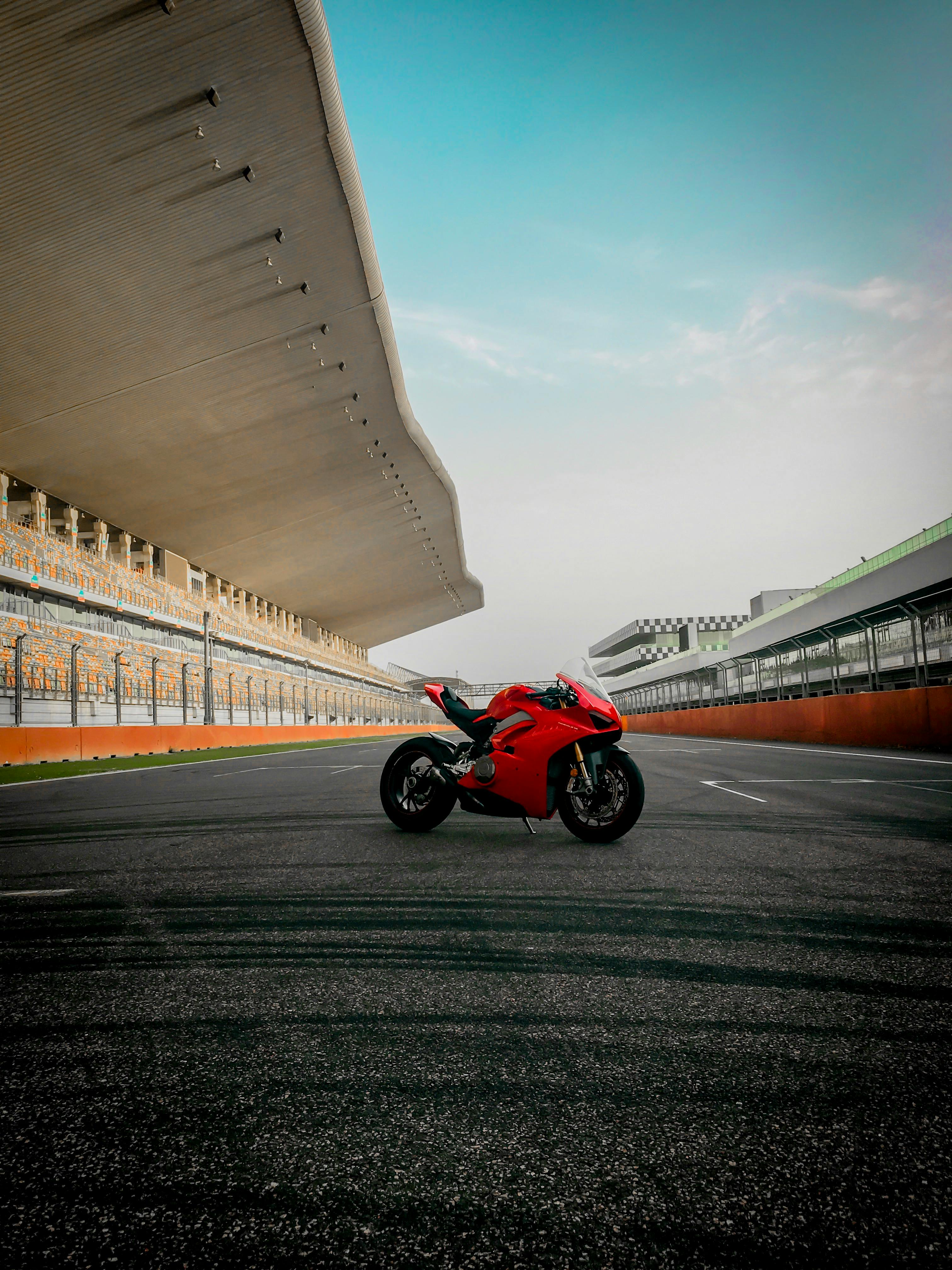 Red Sports Bike in the Middle of Speedway · Free Stock Photo