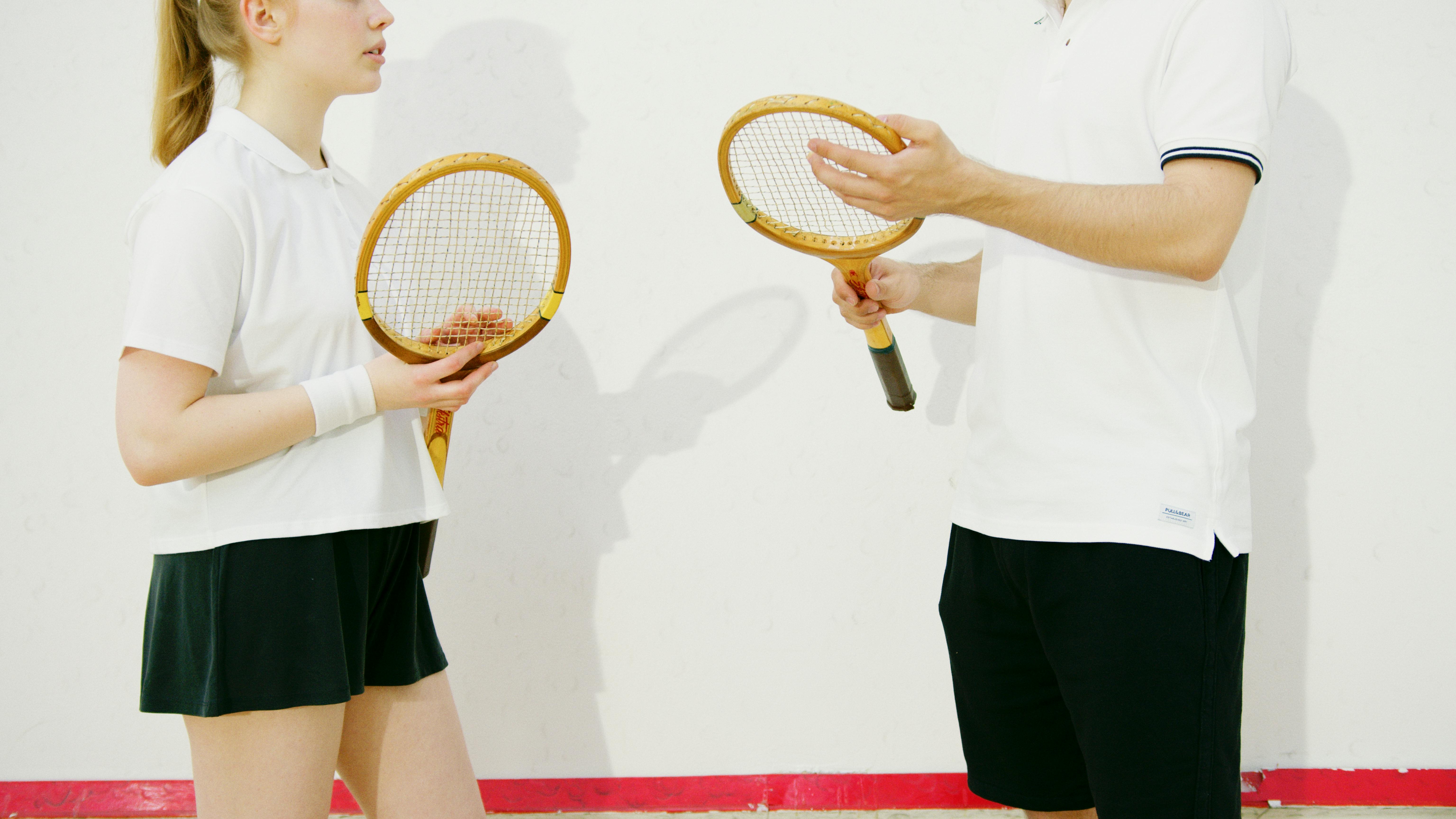 Two People Holding Rackets · Free Stock Photo
