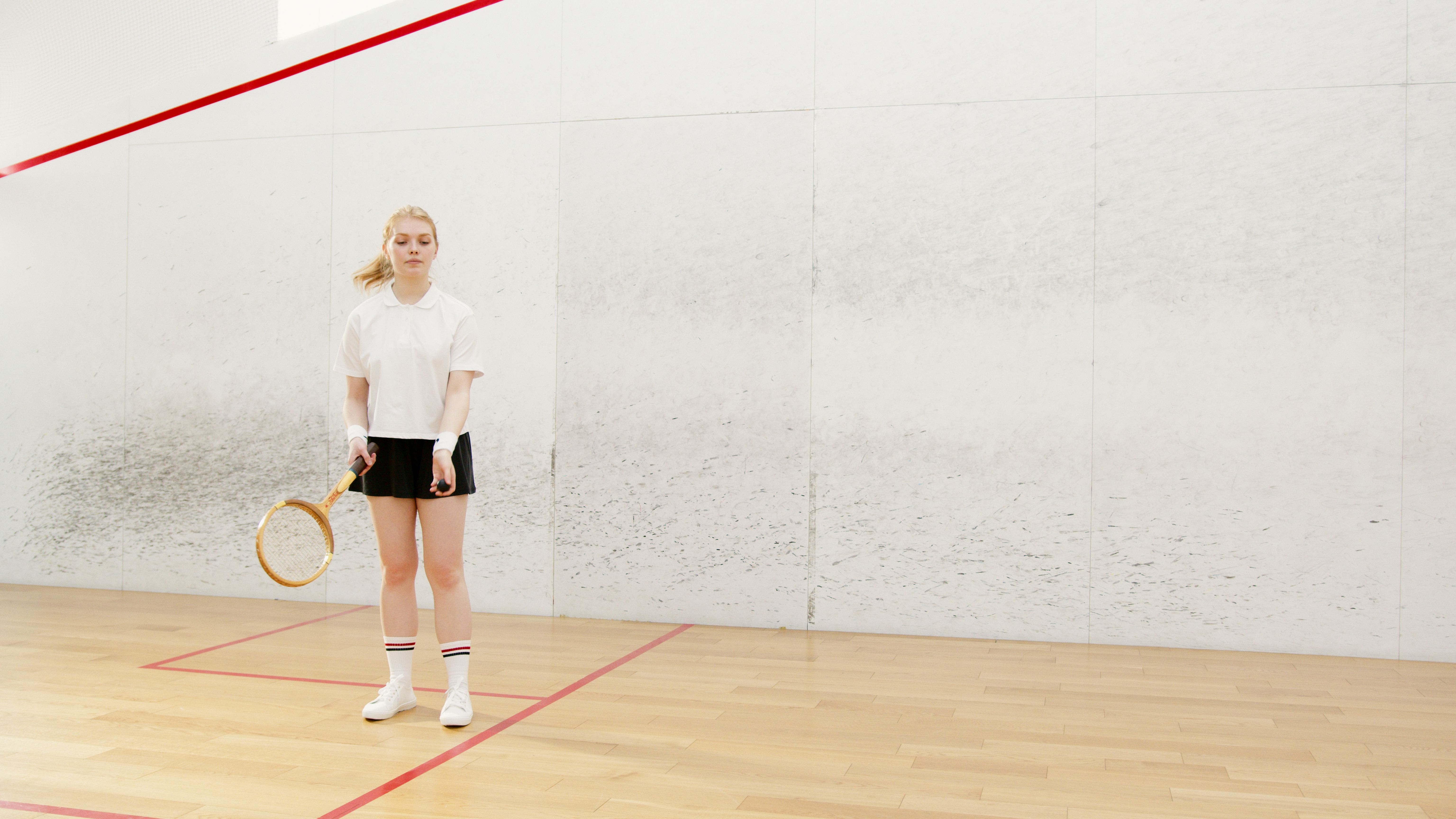 Squash Players Standing beside their Rackets · Free Stock Photo