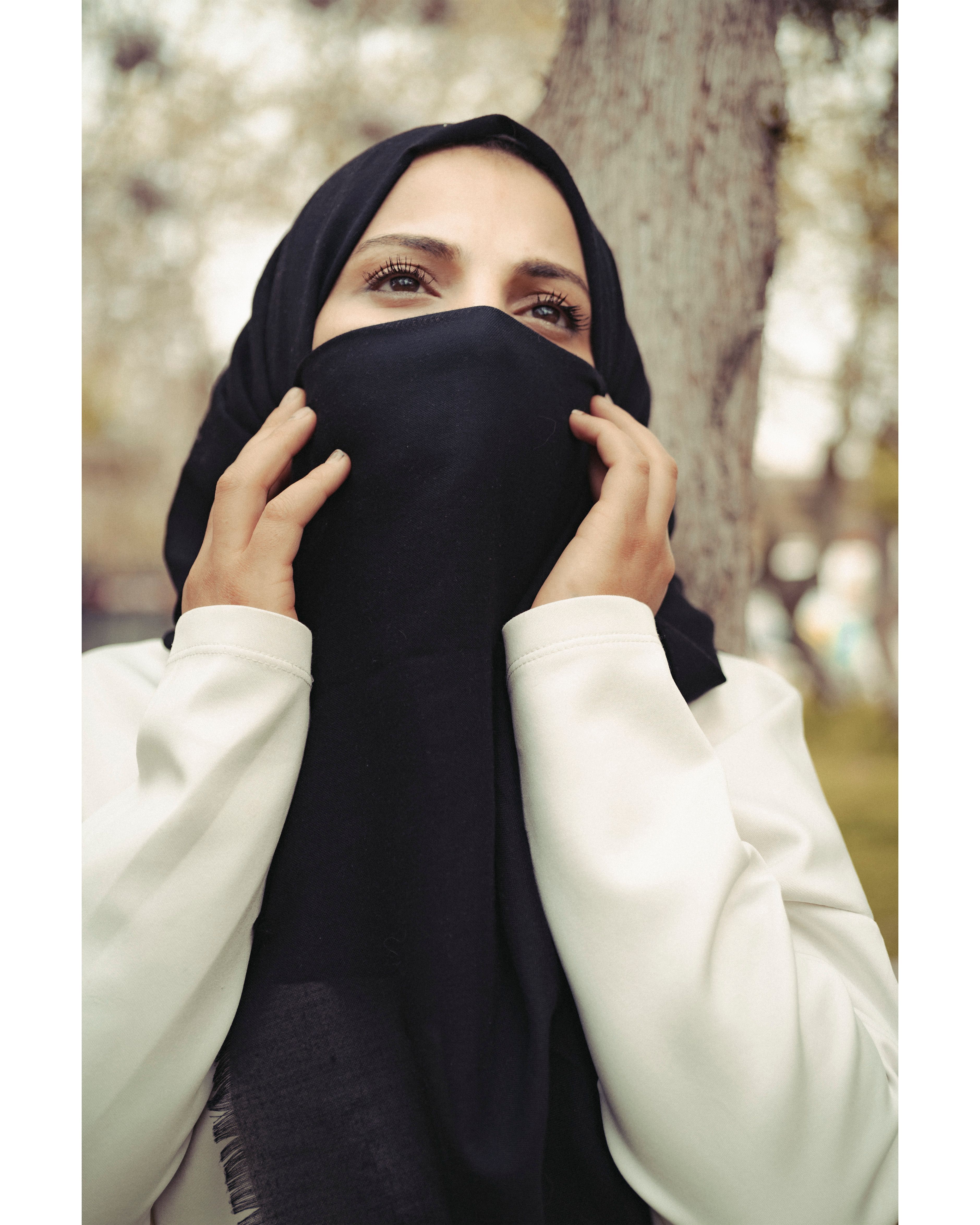 Woman in Black Hijab Covering Her Face · Free Stock Photo