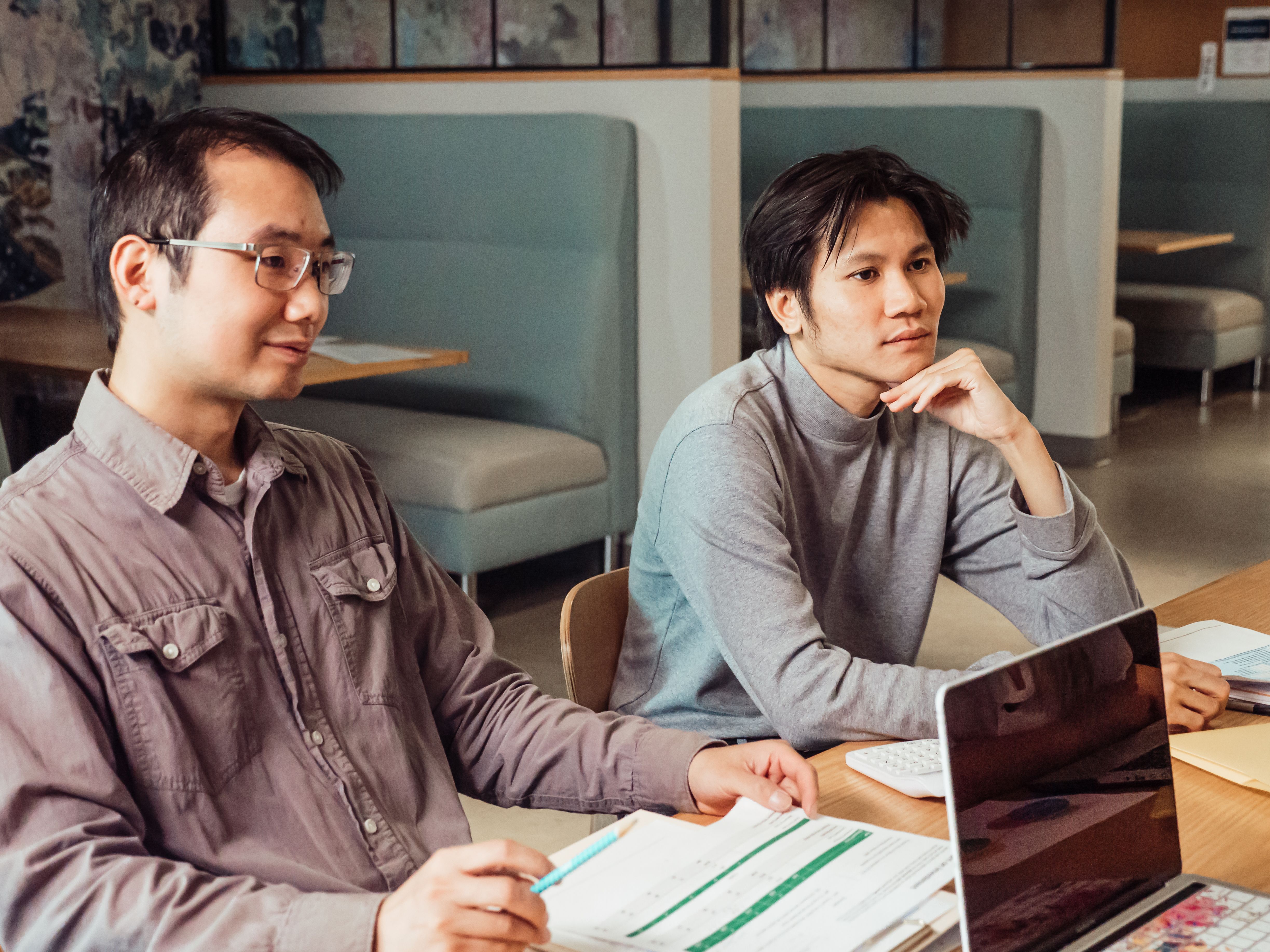 Two Men Sitting Beside Each Other · Free Stock Photo