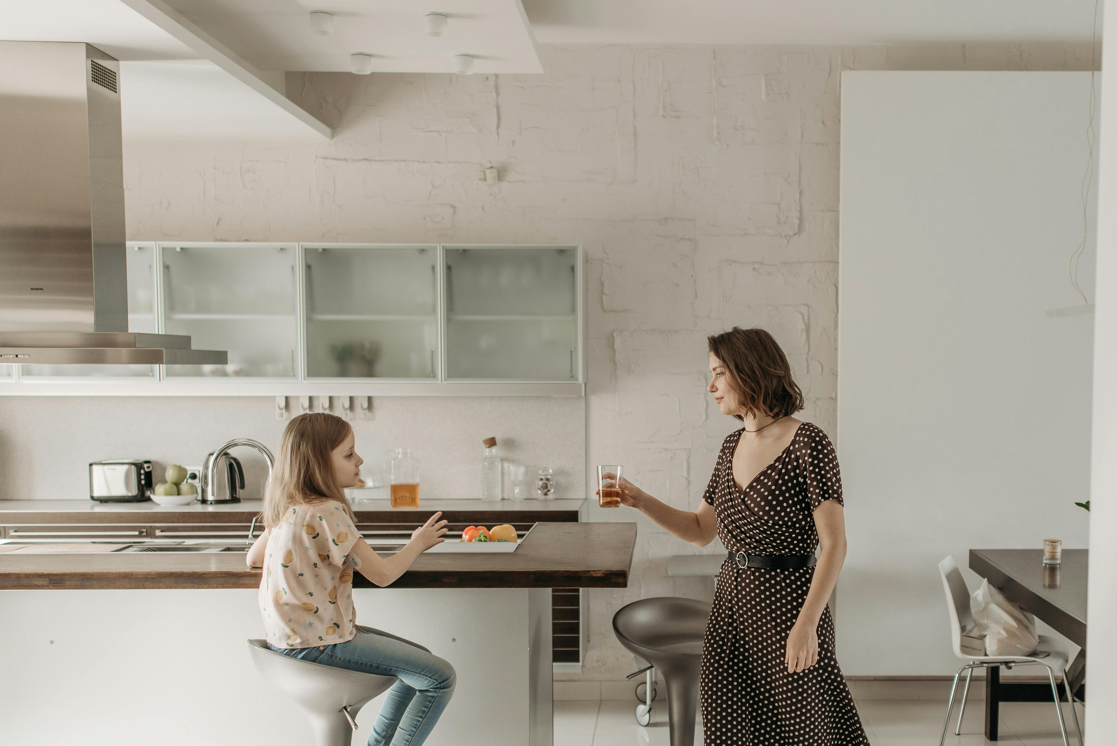 Mother and Daughter in Modern Kitchen · Free Stock Photo