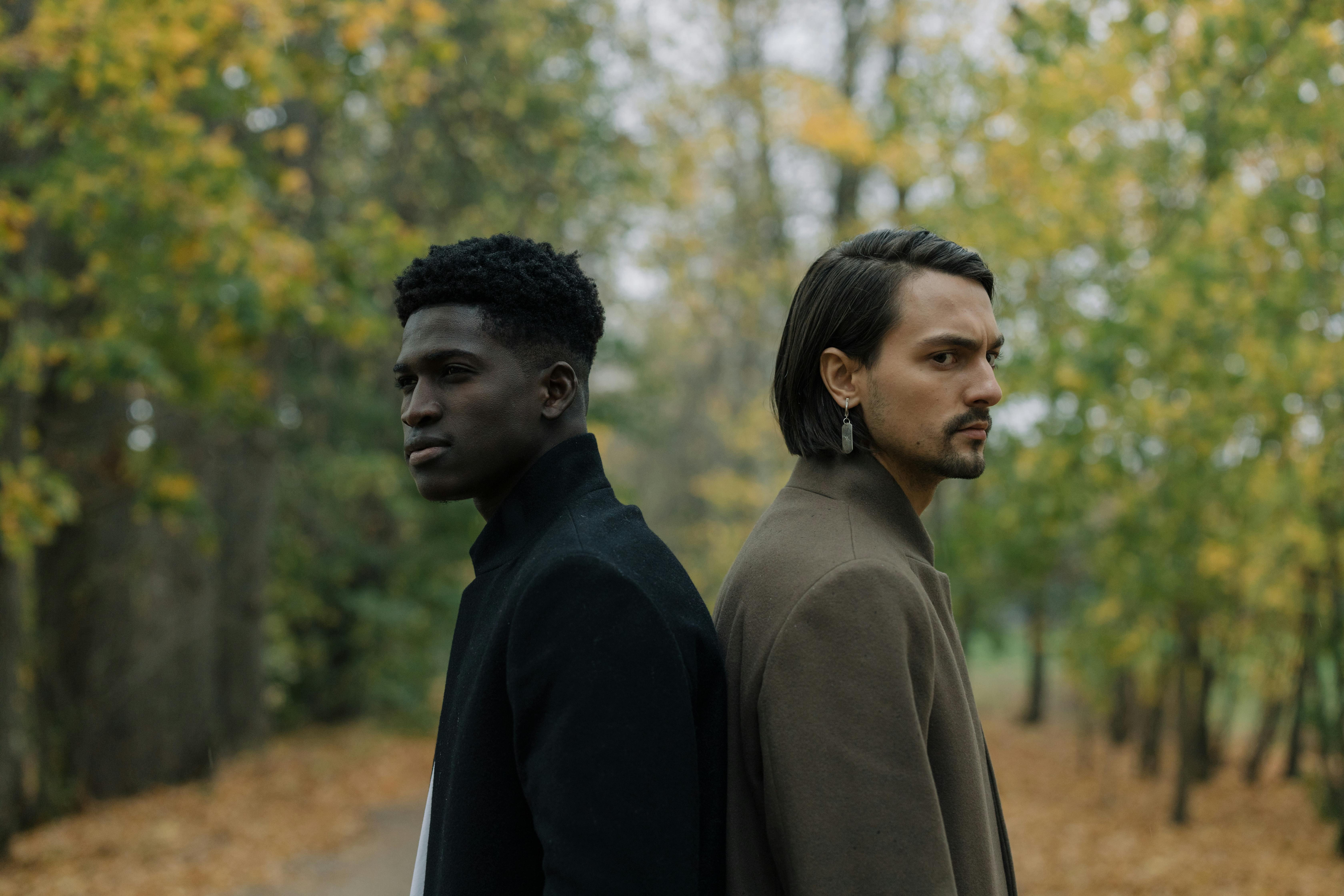 Men Standing Back to Back · Free Stock Photo