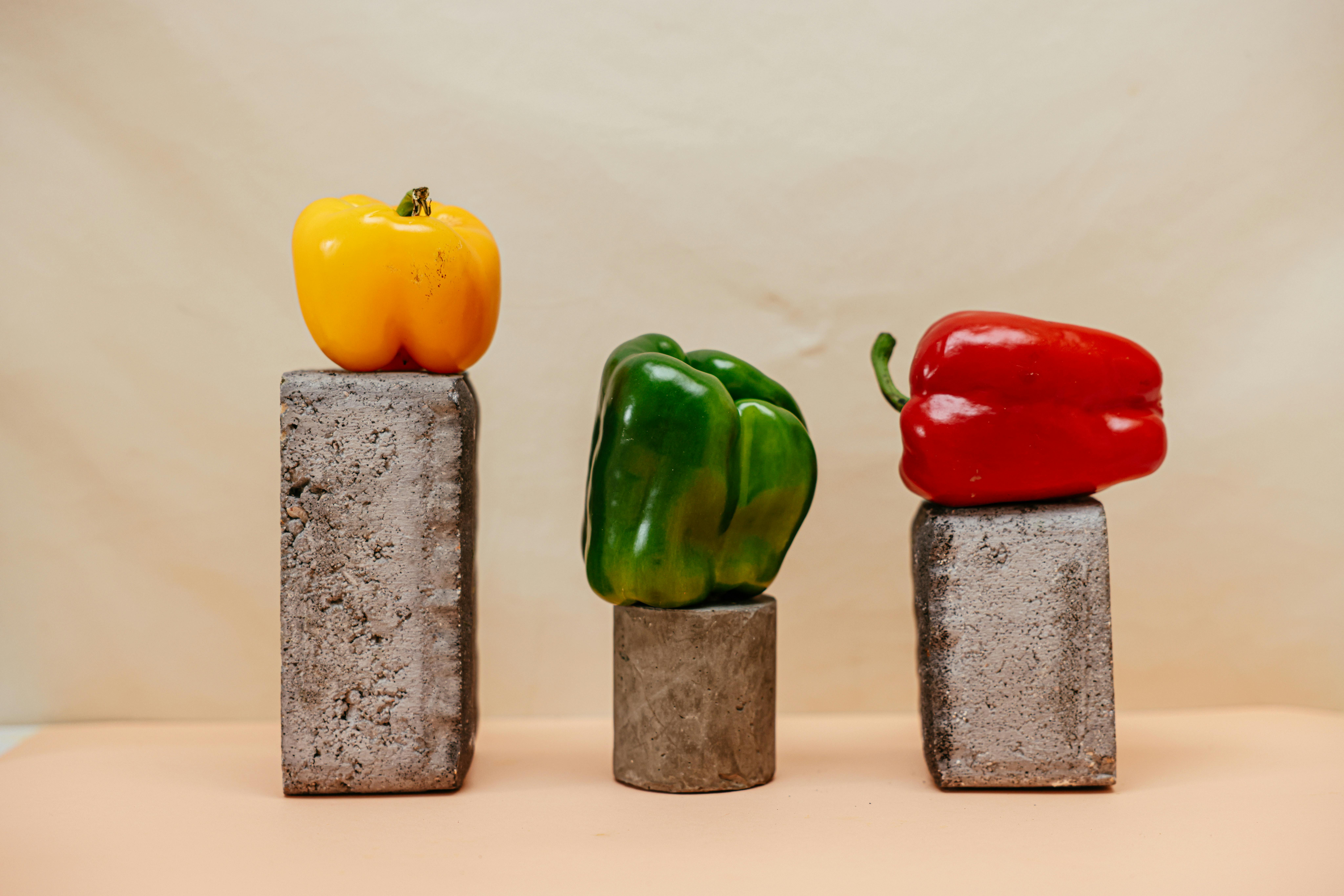 Bell Peppers over Shaped Concrete Blocks · Free Stock Photo