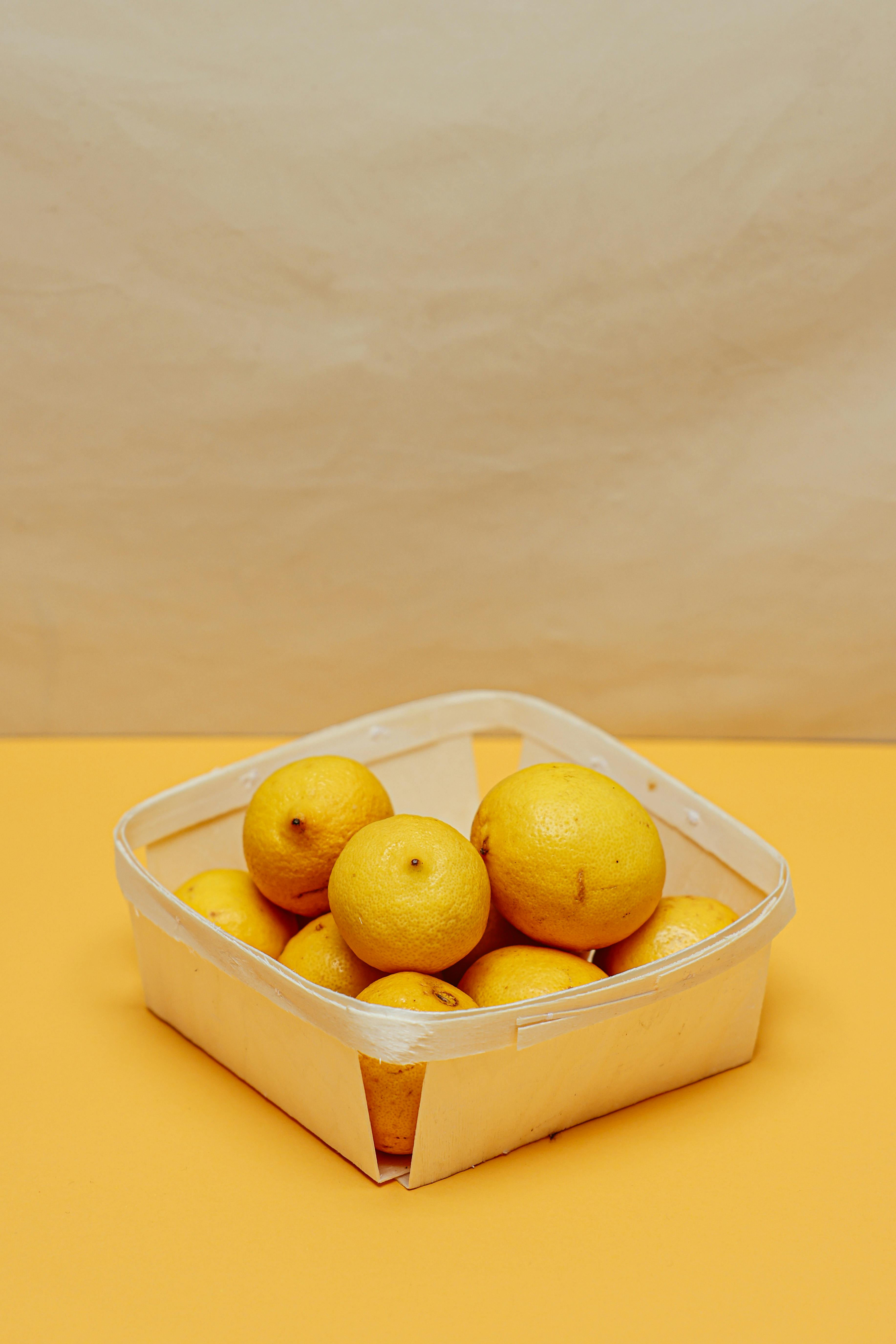 Close Up Photo of Lemons in a Container · Free Stock Photo