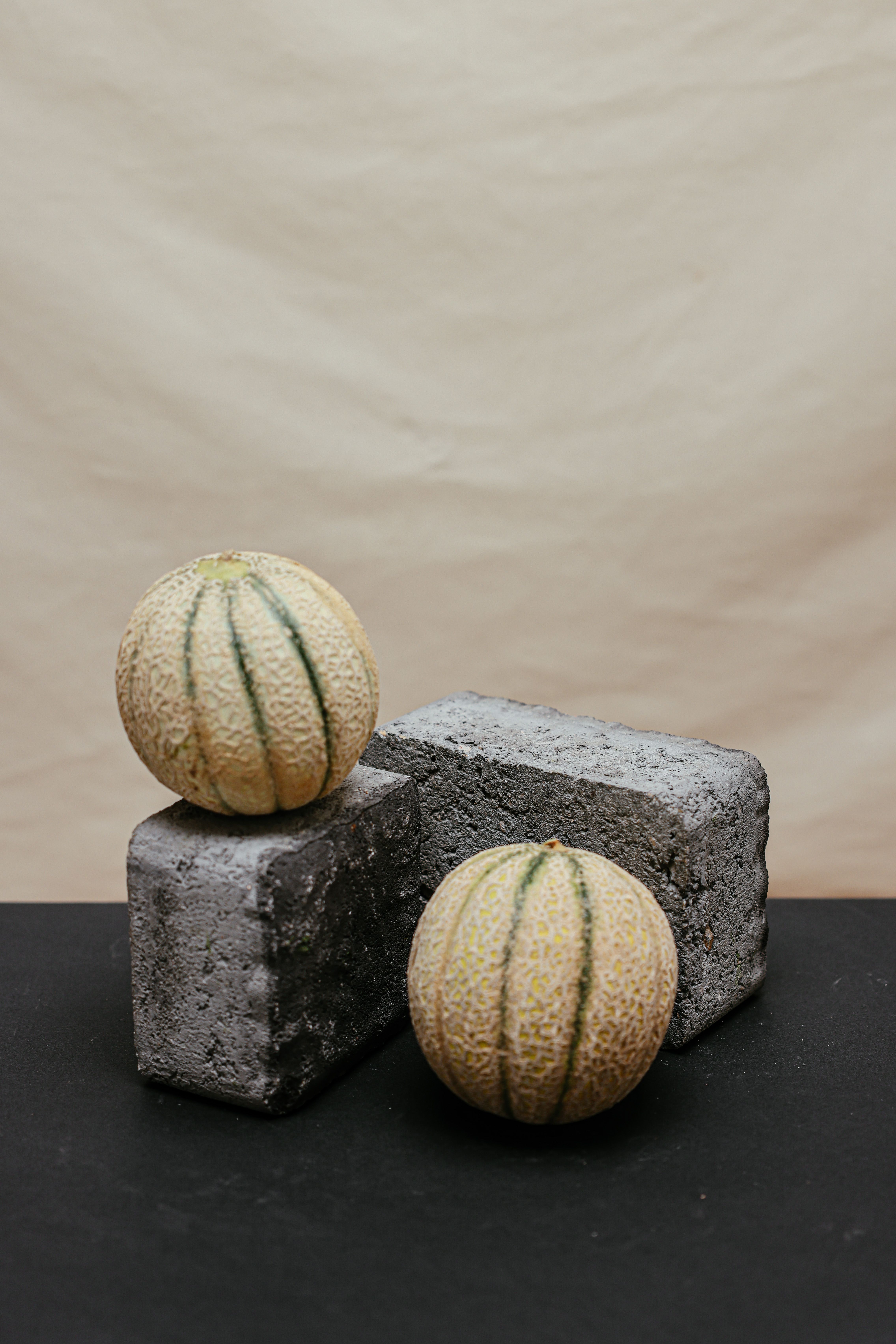 Melons on a Concrete Stand · Free Stock Photo