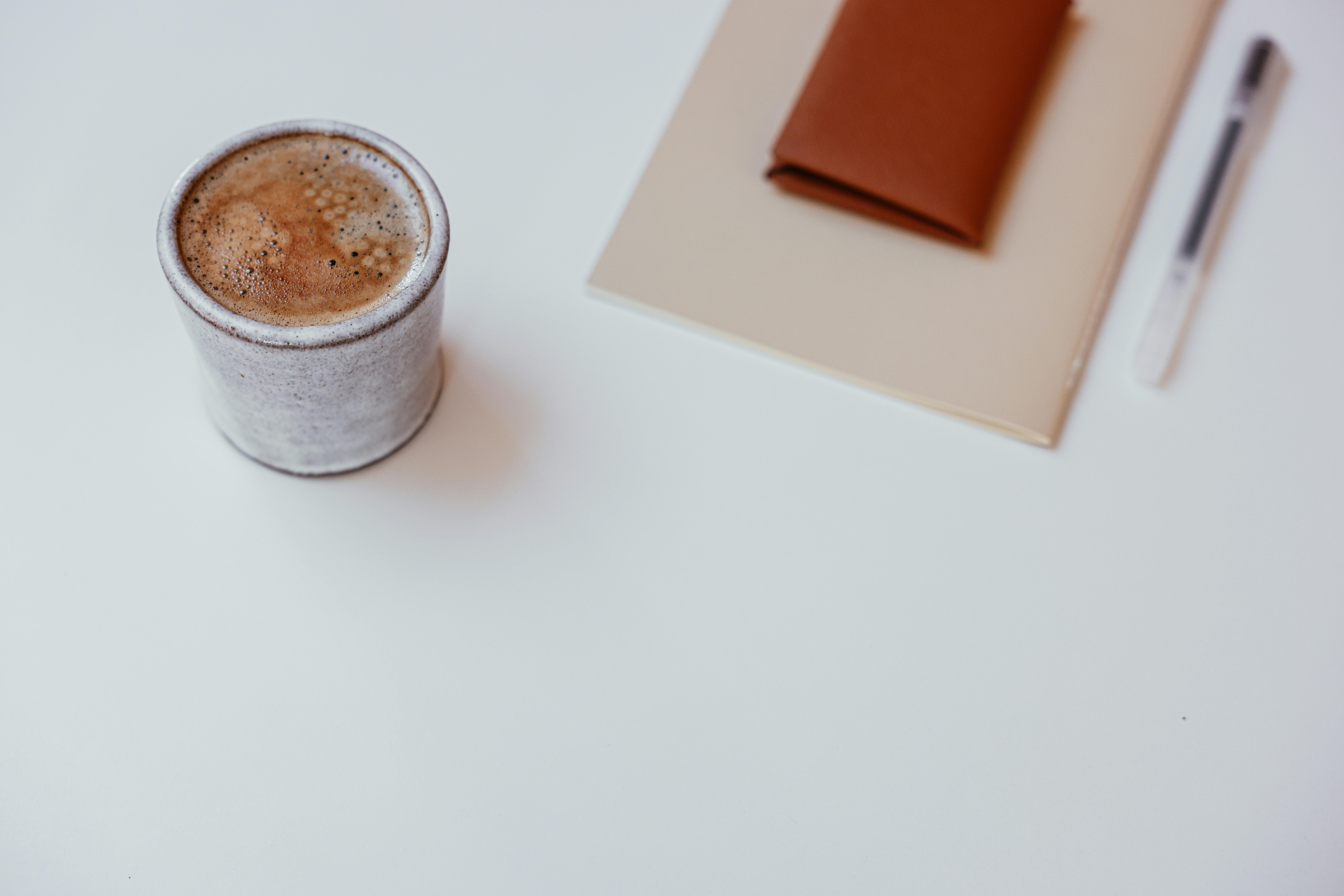 A Cup of Coffee on a Table · Free Stock Photo