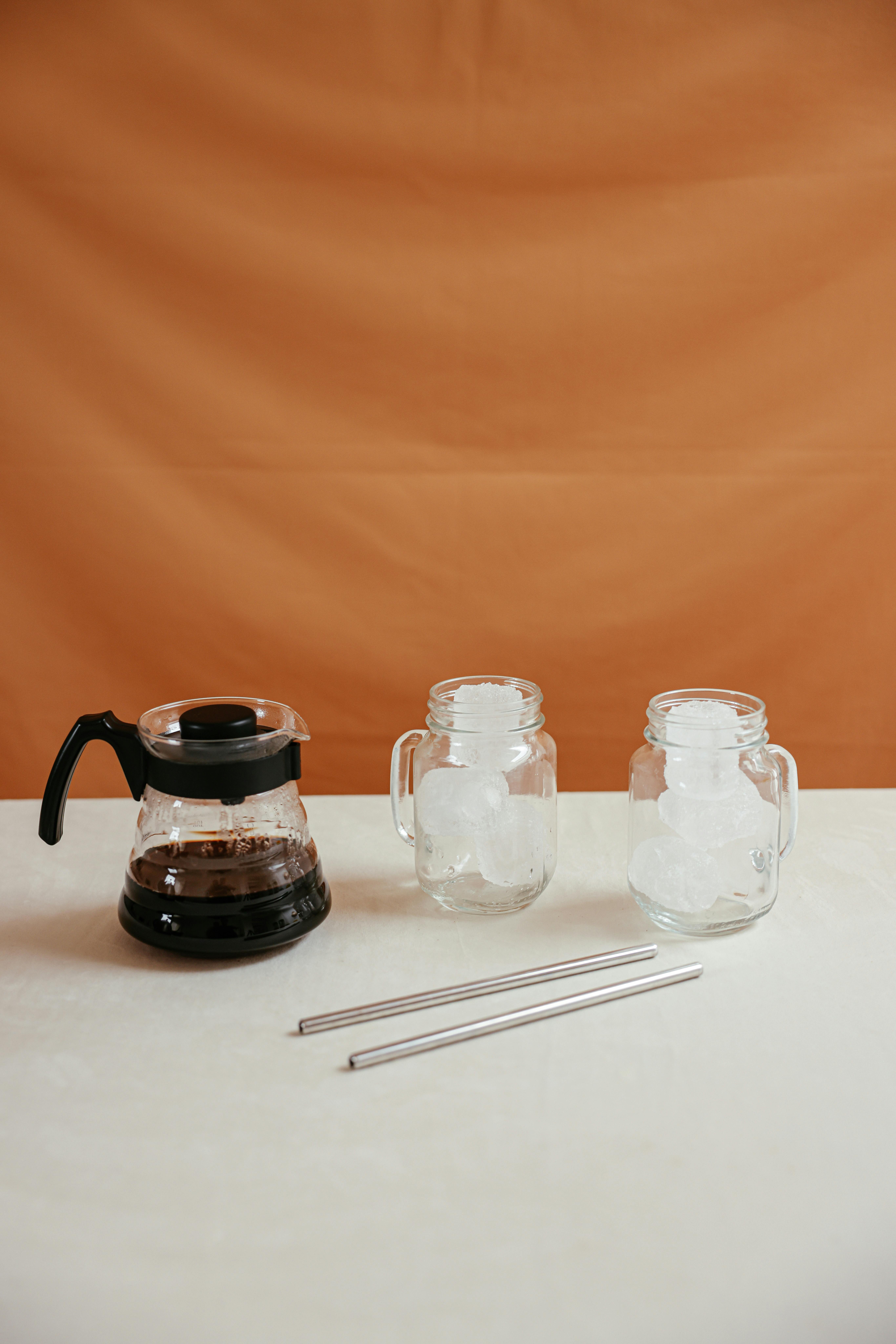 Clear Glass Jars on White Surface · Free Stock Photo