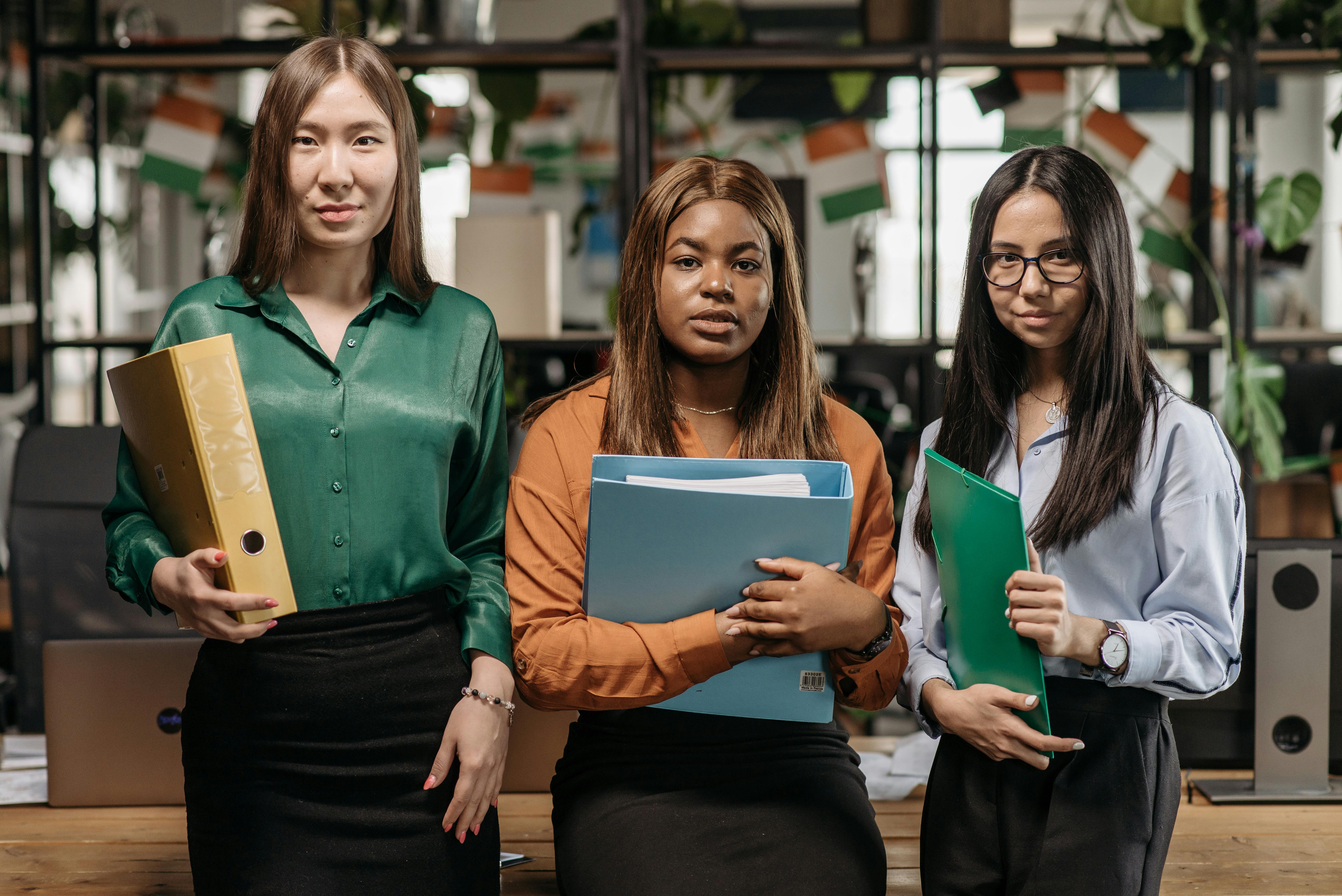 Women Holding Binders · Free Stock Photo