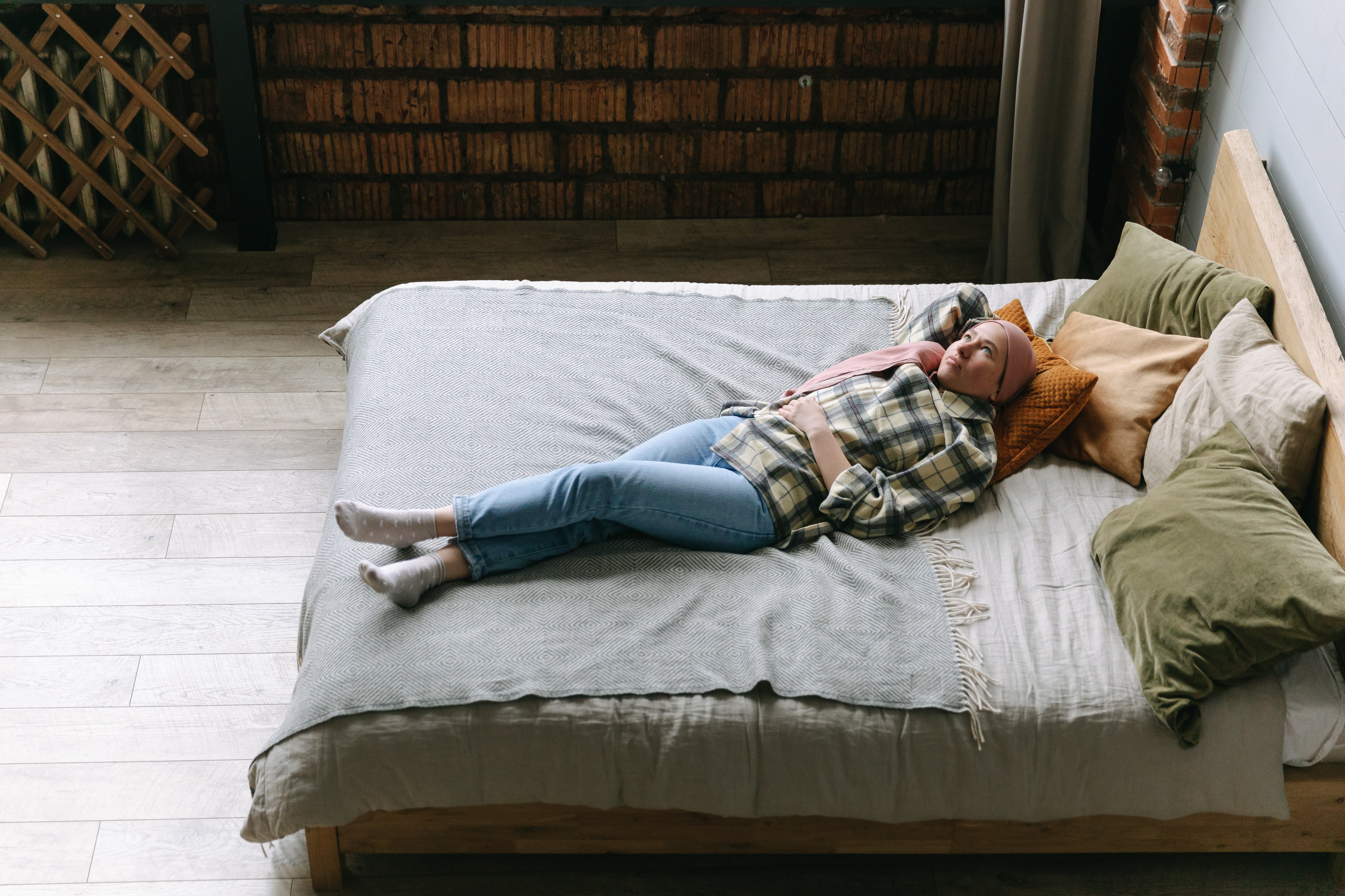 A Woman Lying on the Bed · Free Stock Photo