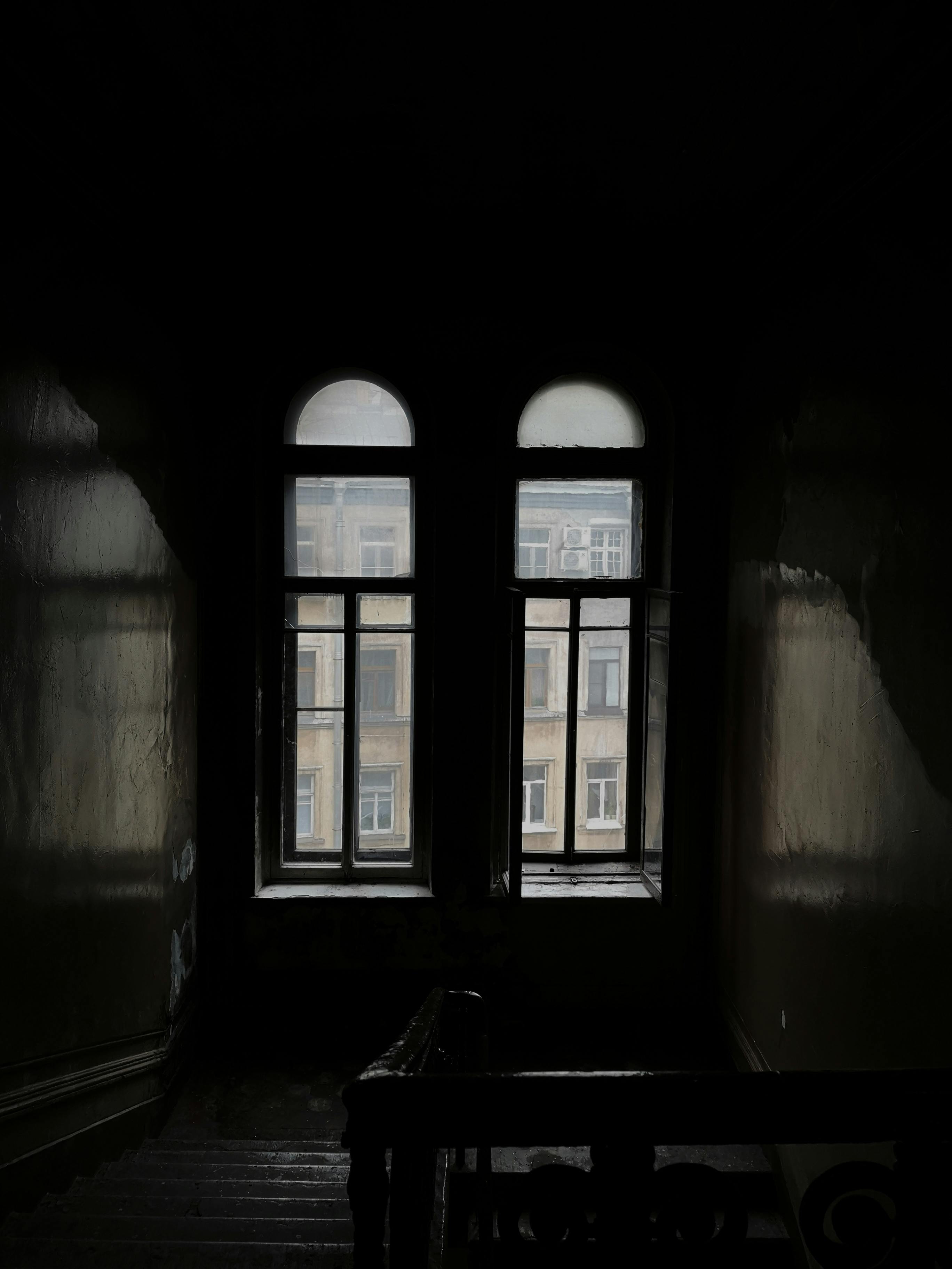 An Arched Shaped Window Near Stairs · Free Stock Photo