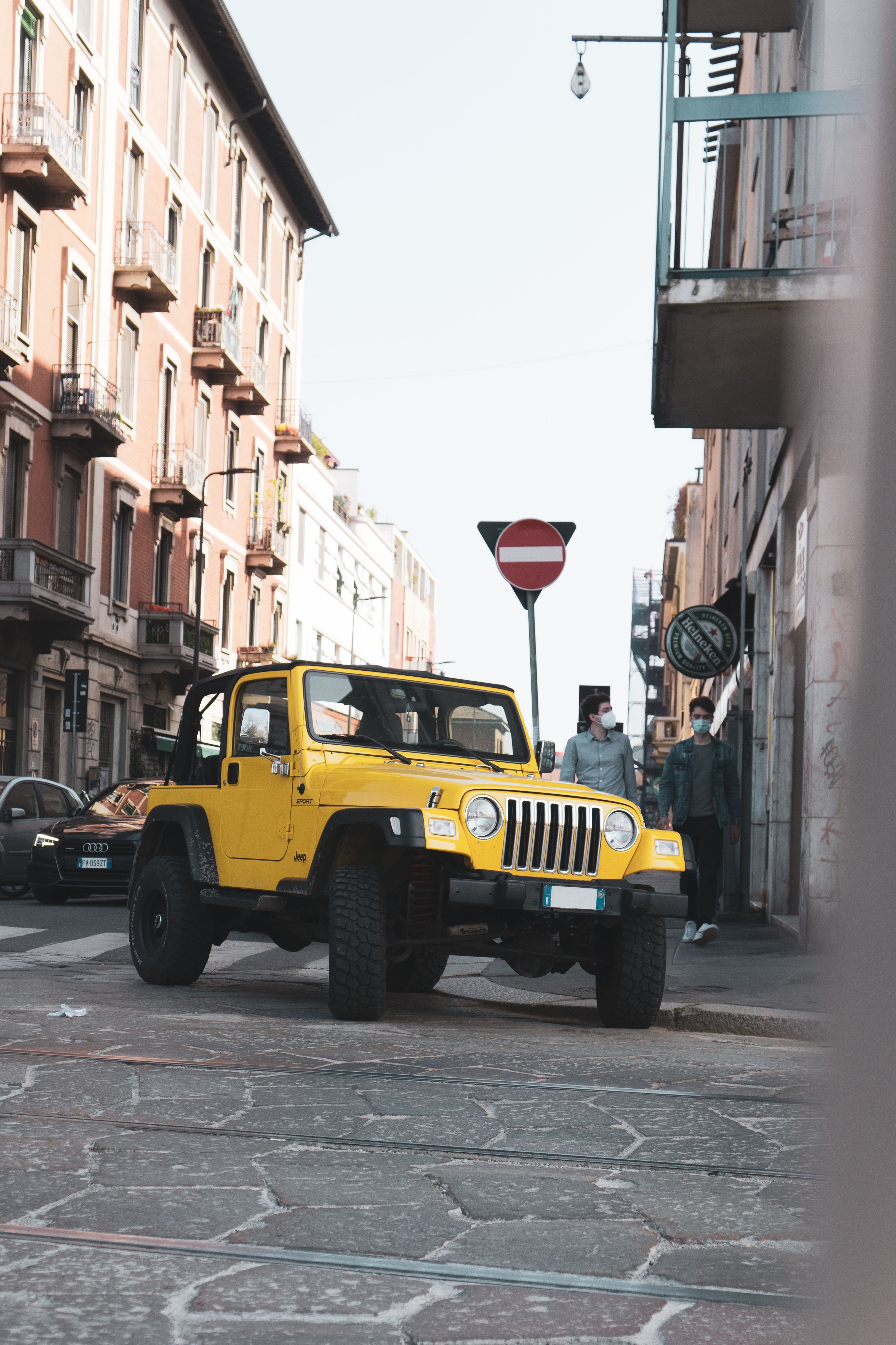 Yellow Vehicle Parked on Street Side · Free Stock Photo