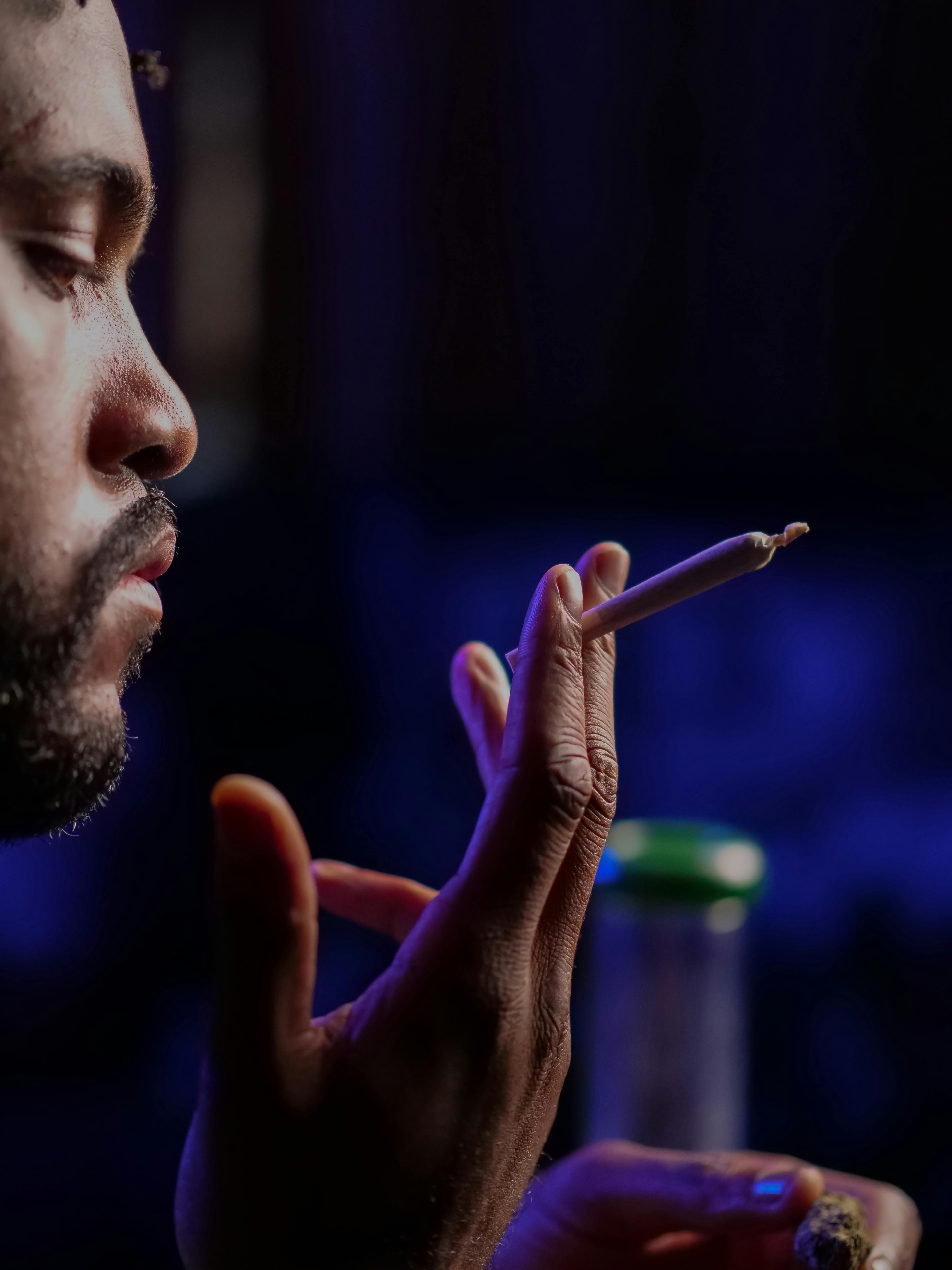 Photo of Man Holding Joint · Free Stock Photo