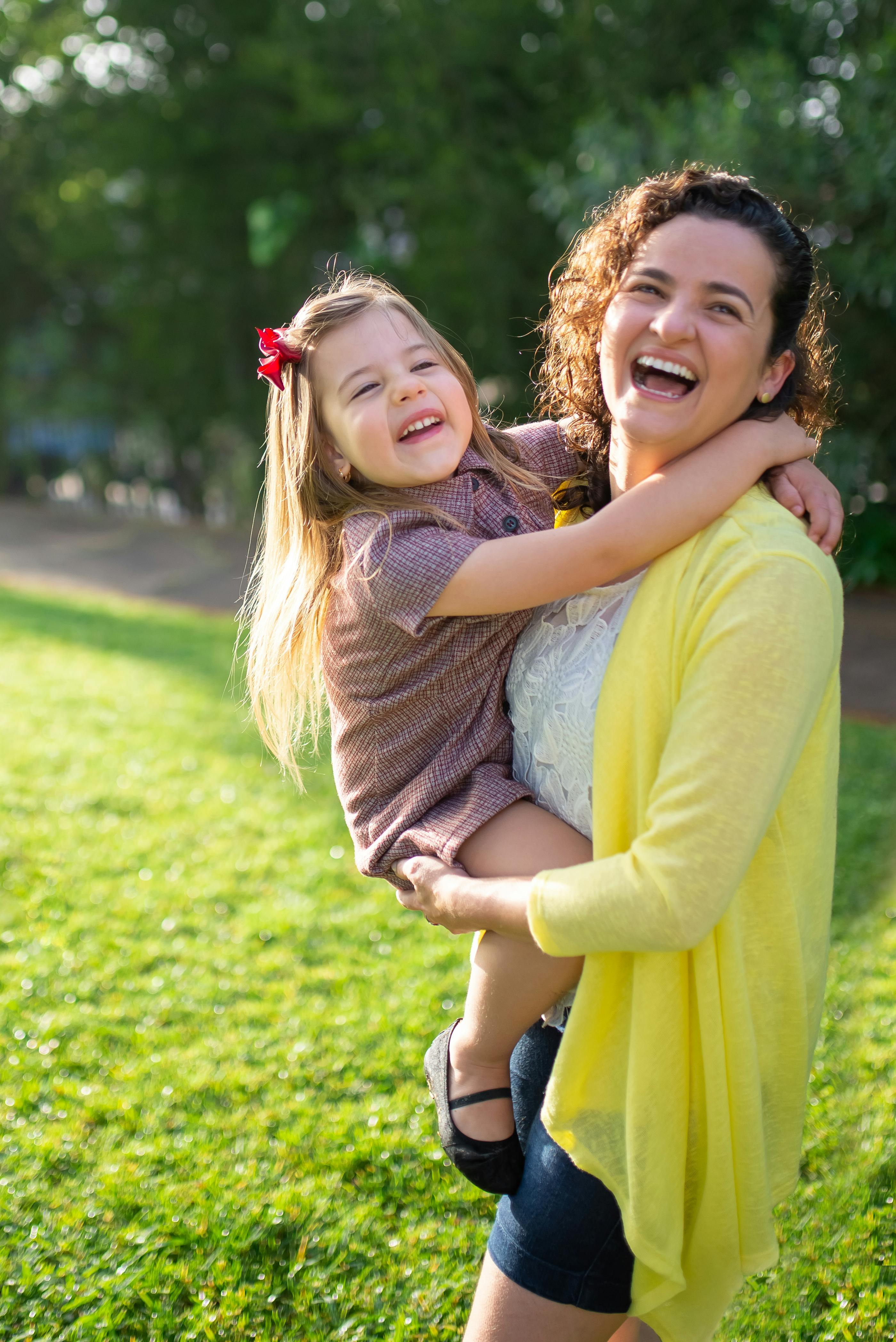 Woman Carrying a Little Girl · Free Stock Photo