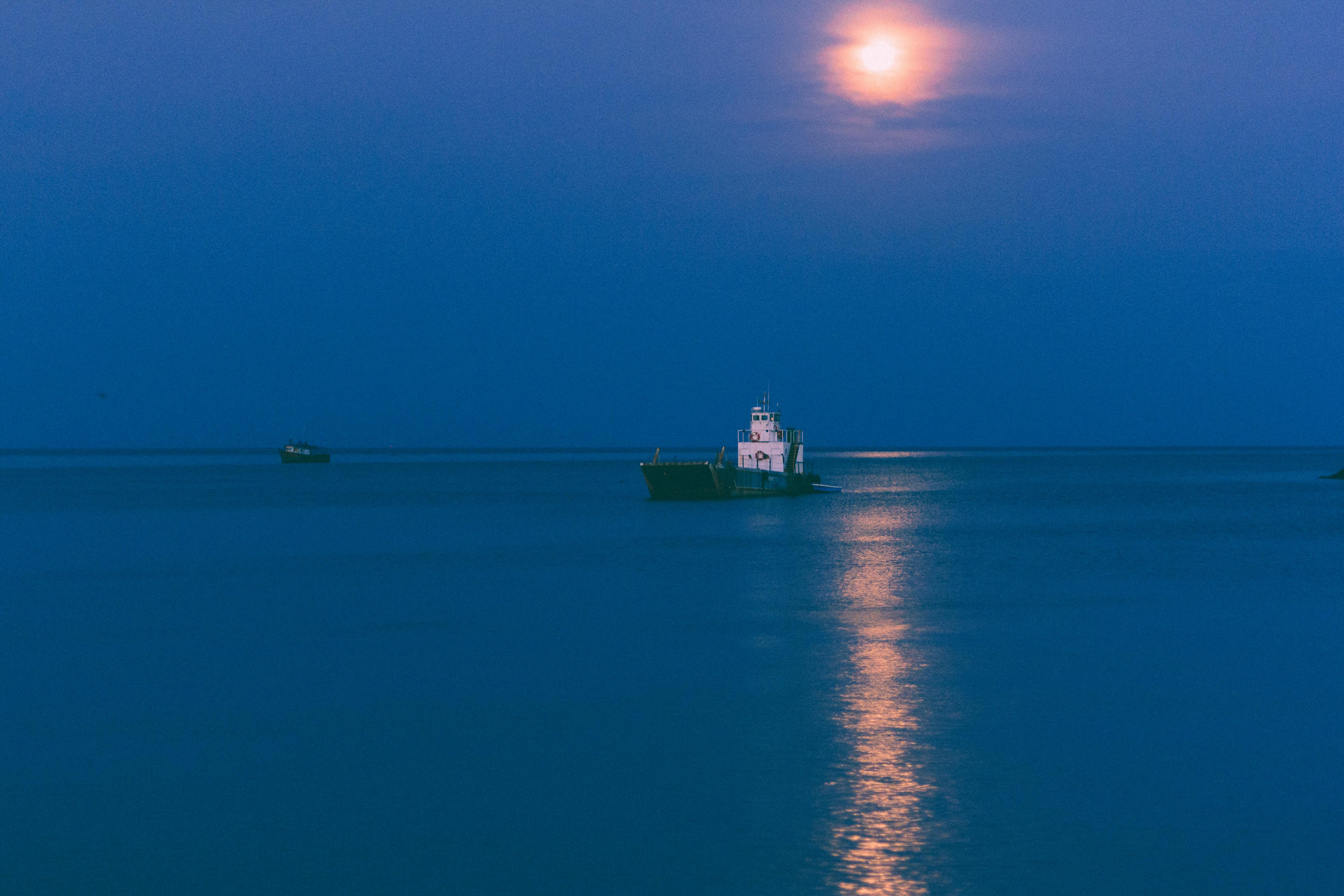 Boat on Sea during Night Time · Free Stock Photo