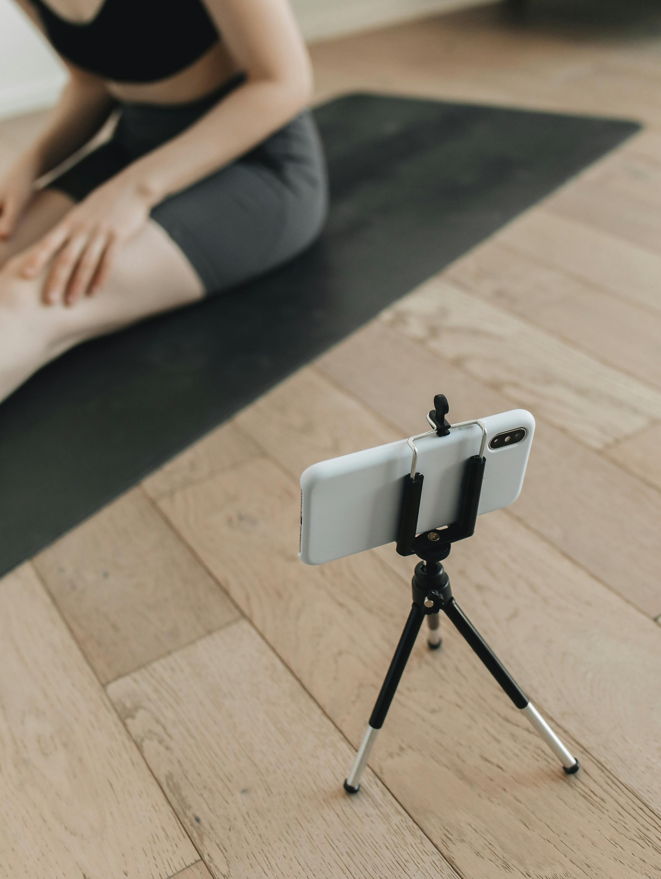 Trainer Recording Fitness Session · Free Stock Photo