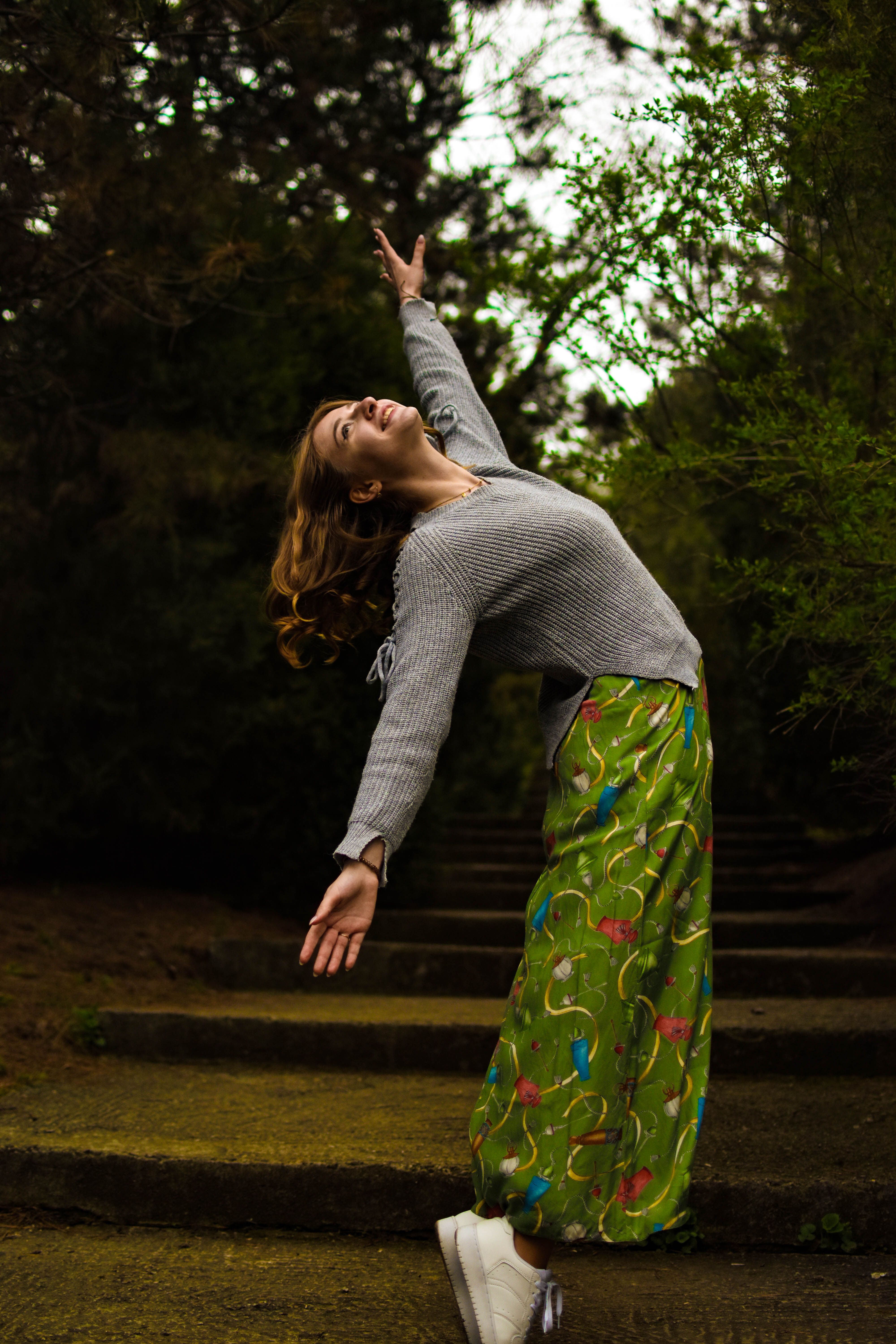 Woman Posing with Arms Raised · Free Stock Photo