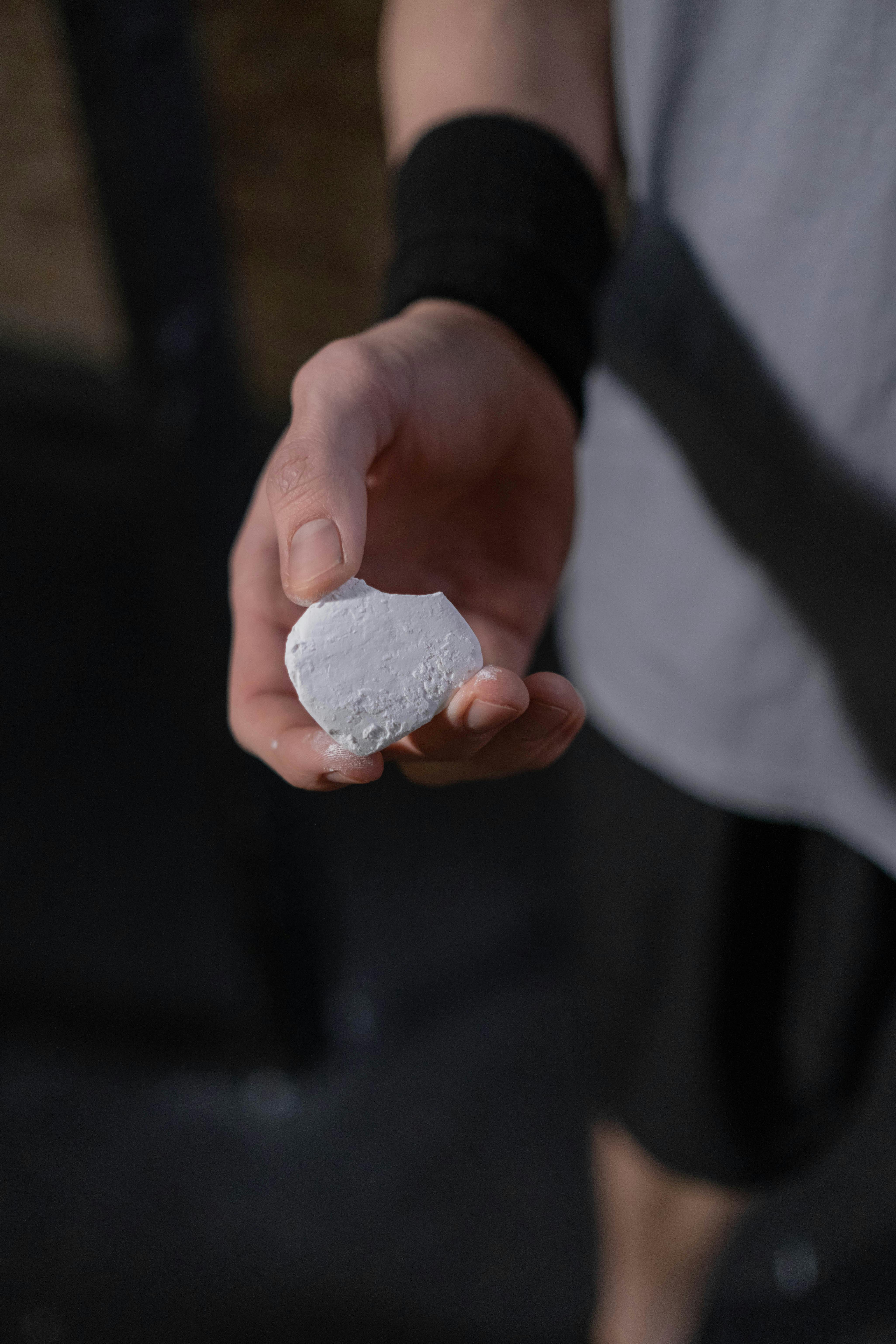 Close-Up View of a Person Putting Talc in His Hands · Free Stock Photo