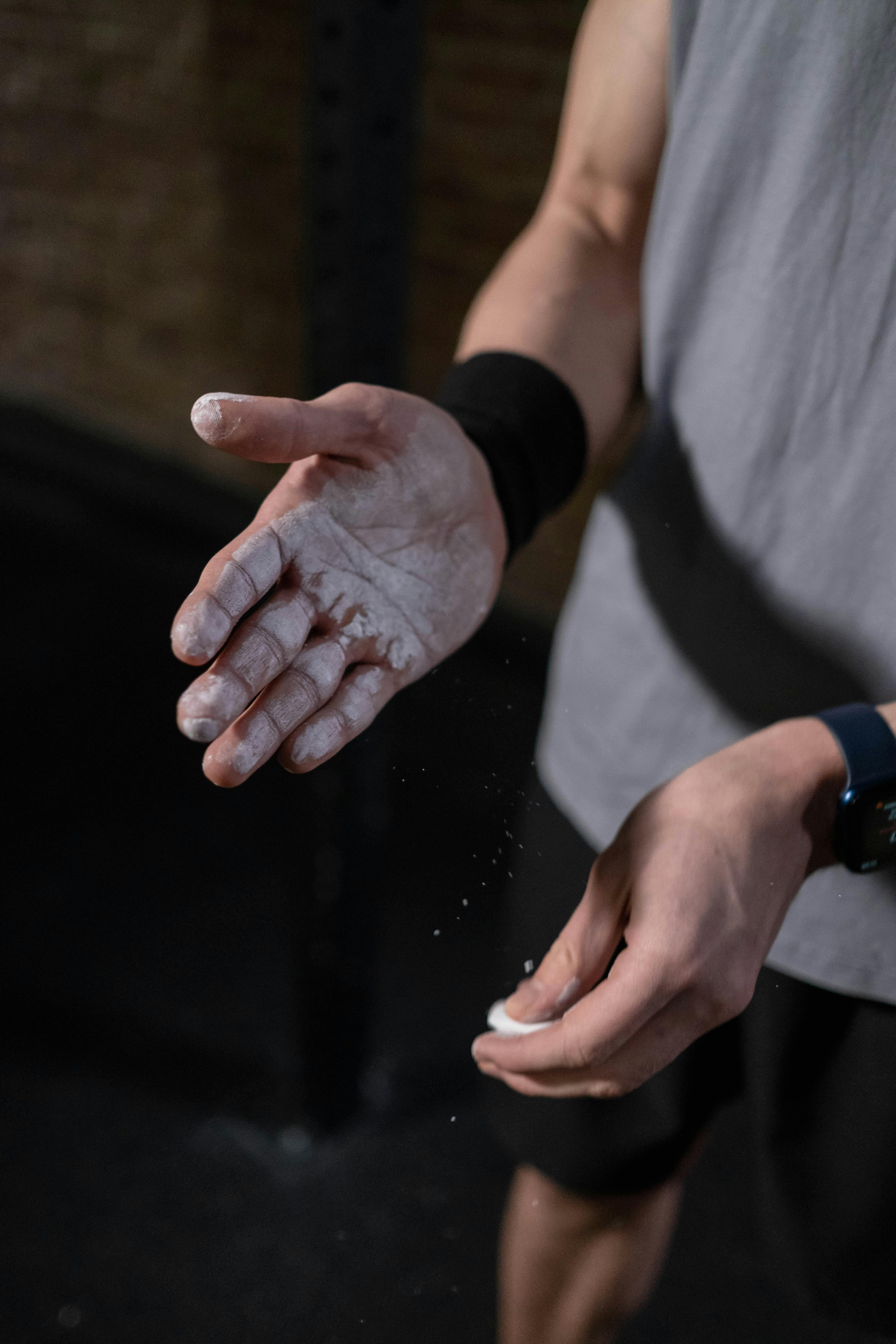 Close-Up View of a Person Putting Talc in His Hands · Free Stock Photo