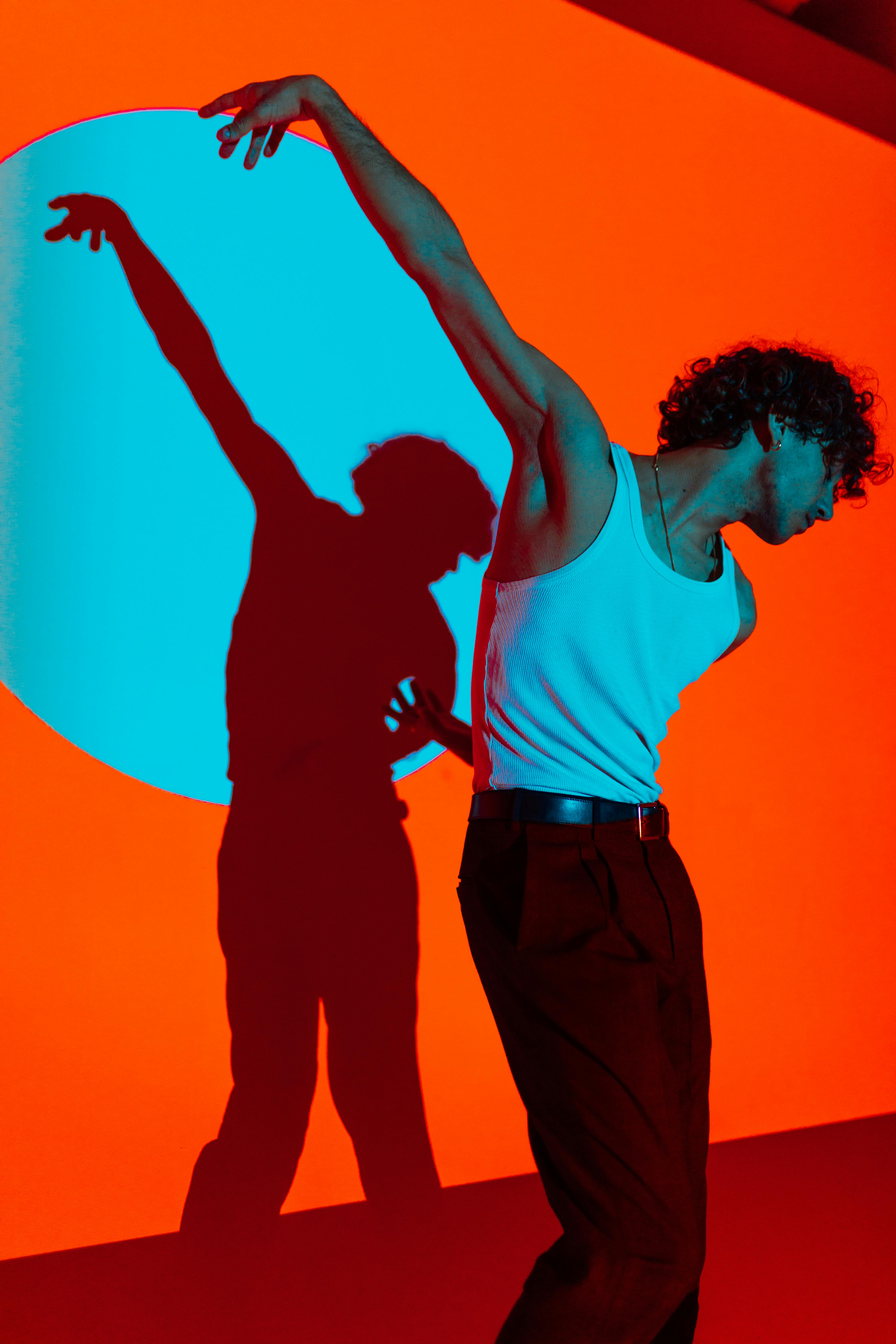 Man in White Tank Top Dancing · Free Stock Photo