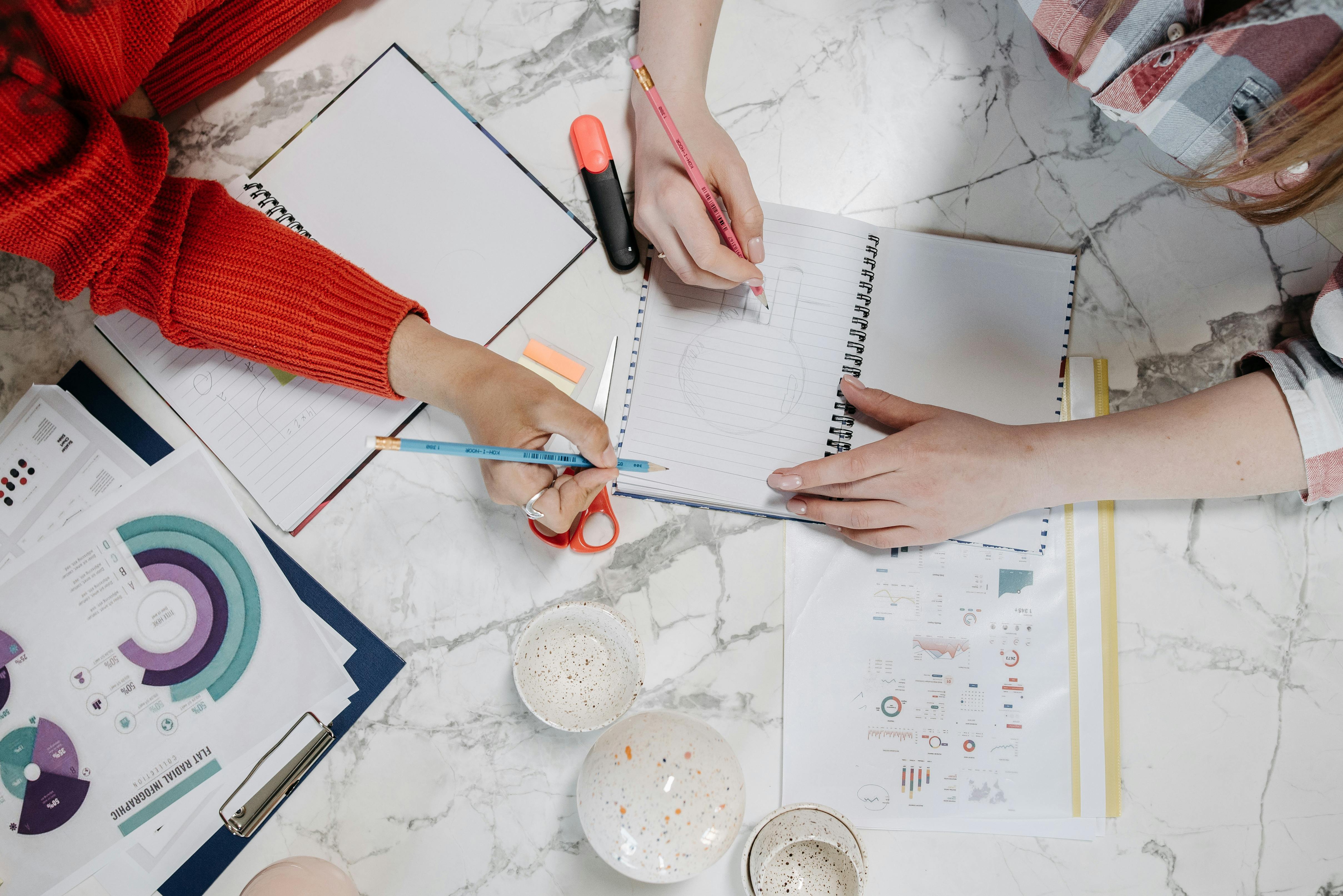 People Drawing on White Notebook · Free Stock Photo