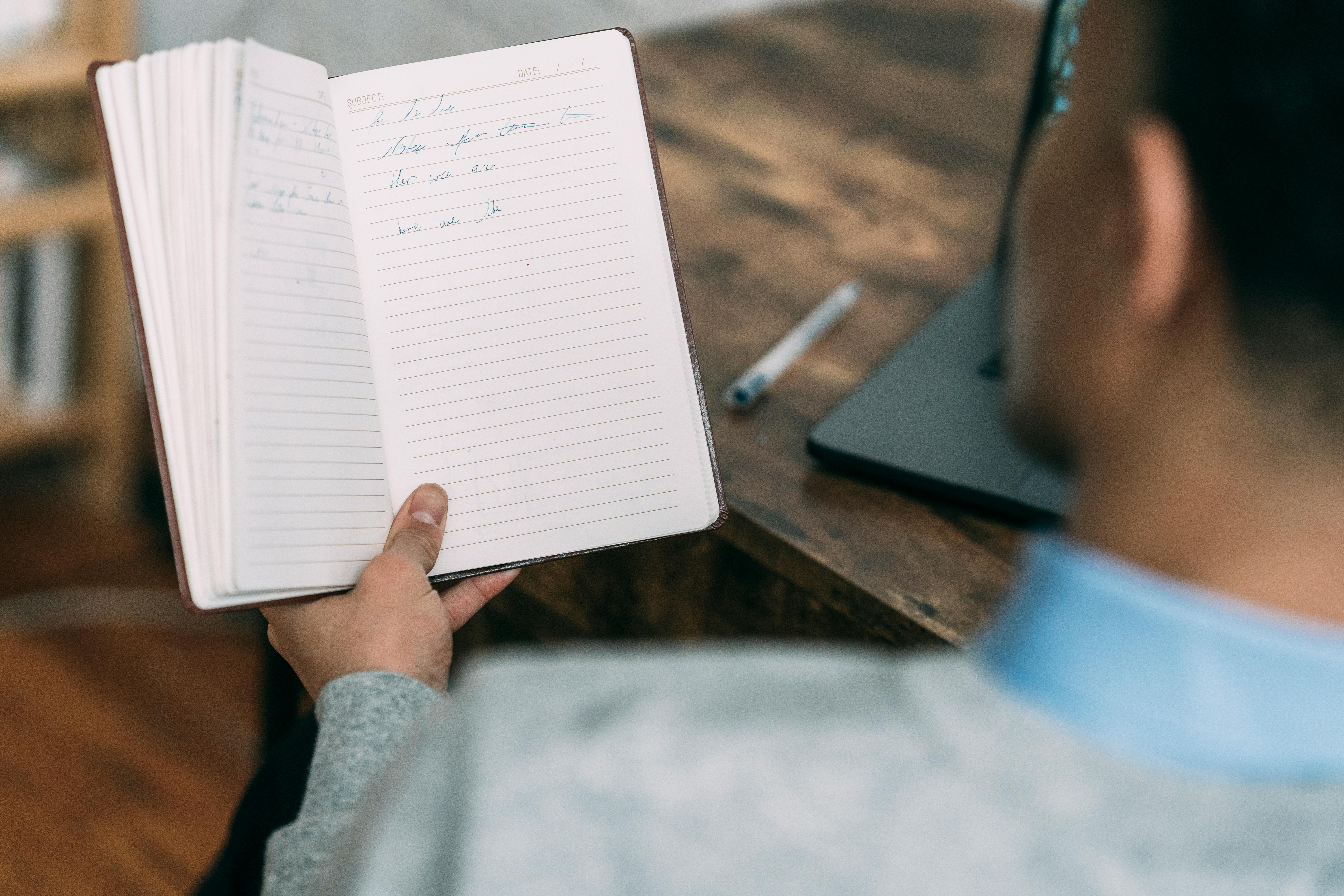 Unrecognizable man reading notes in office · Free Stock Photo