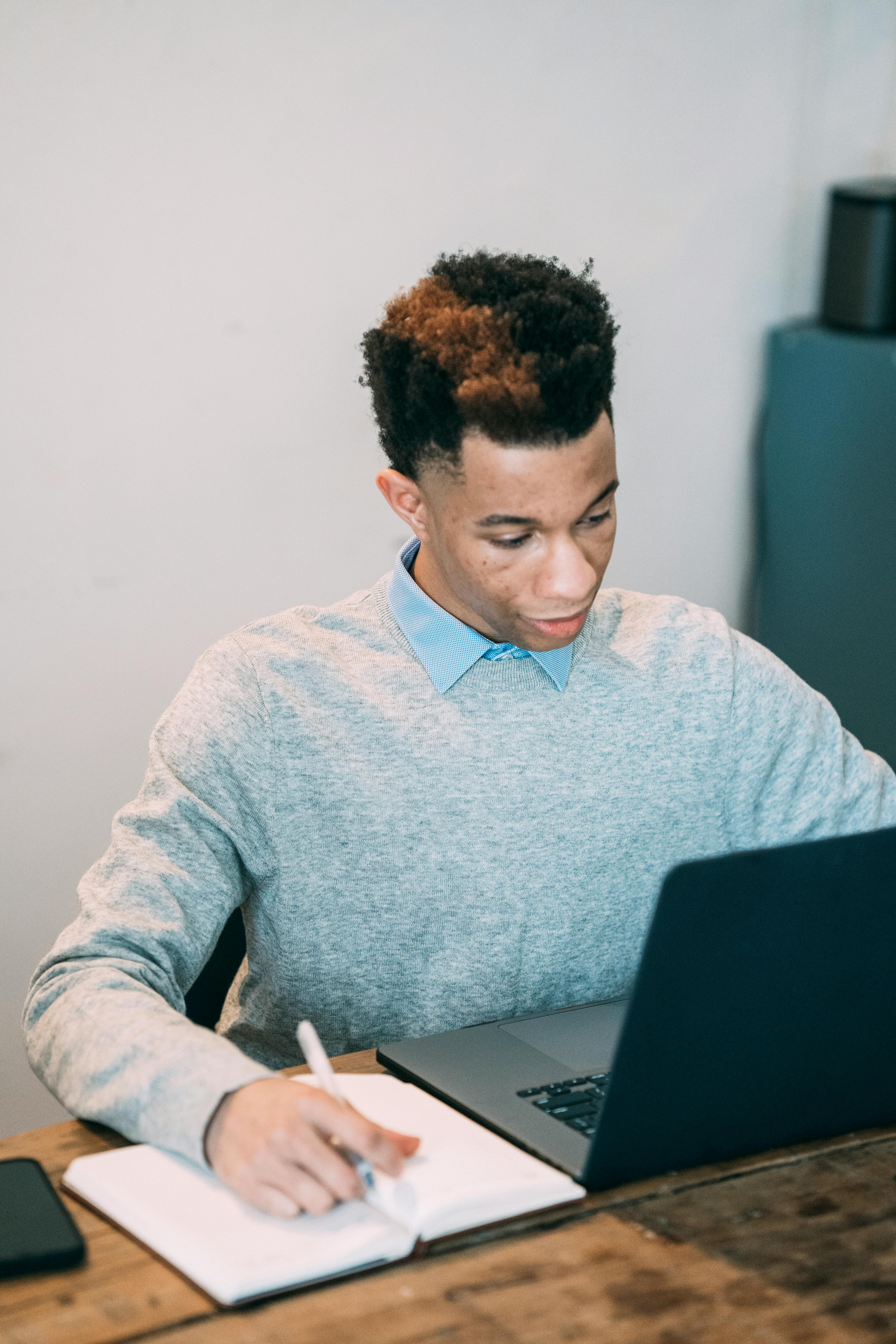 Focused woman working on laptop · Free Stock Photo