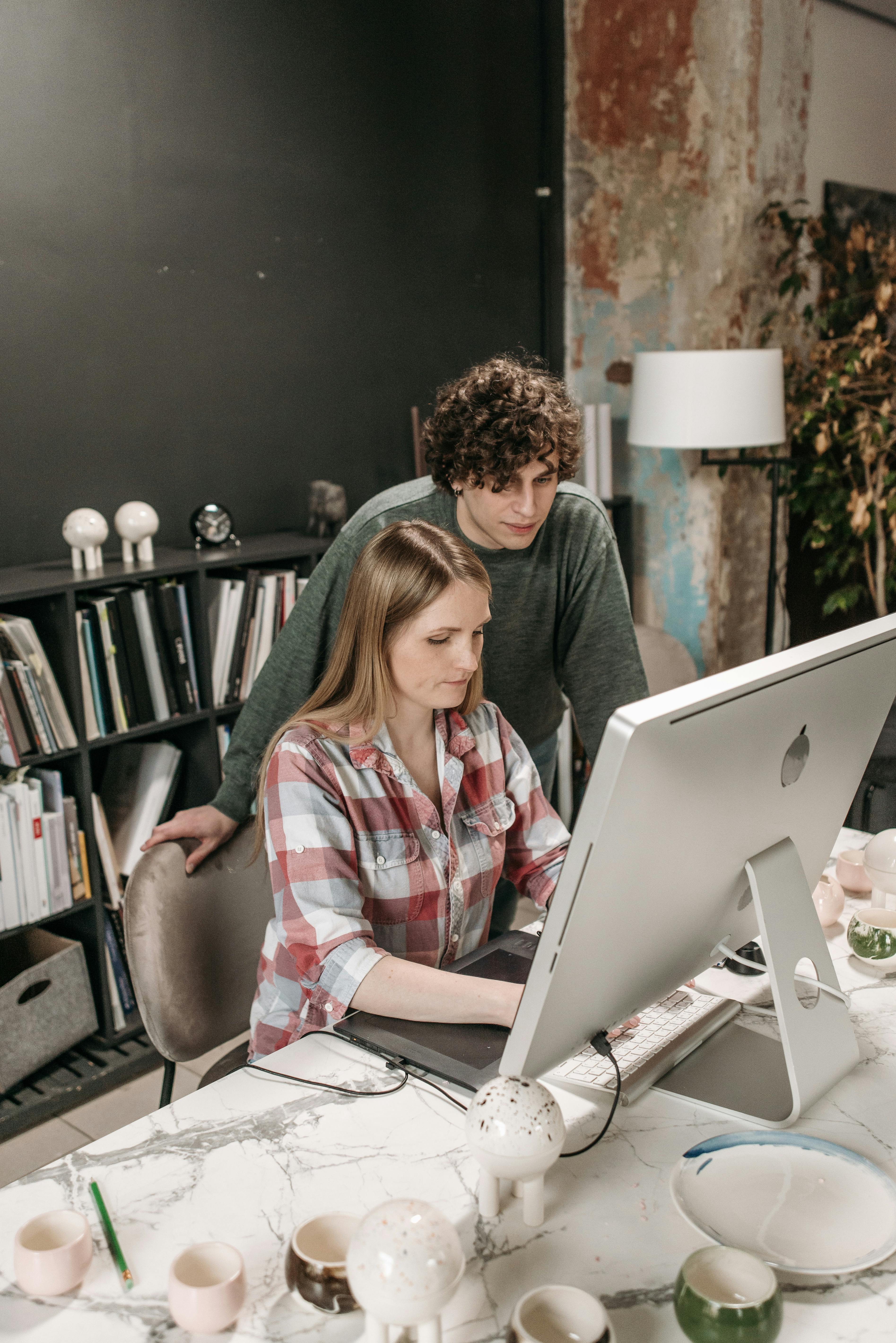 Businesspeople Working Inside an Office with a Computer · Free Stock Photo