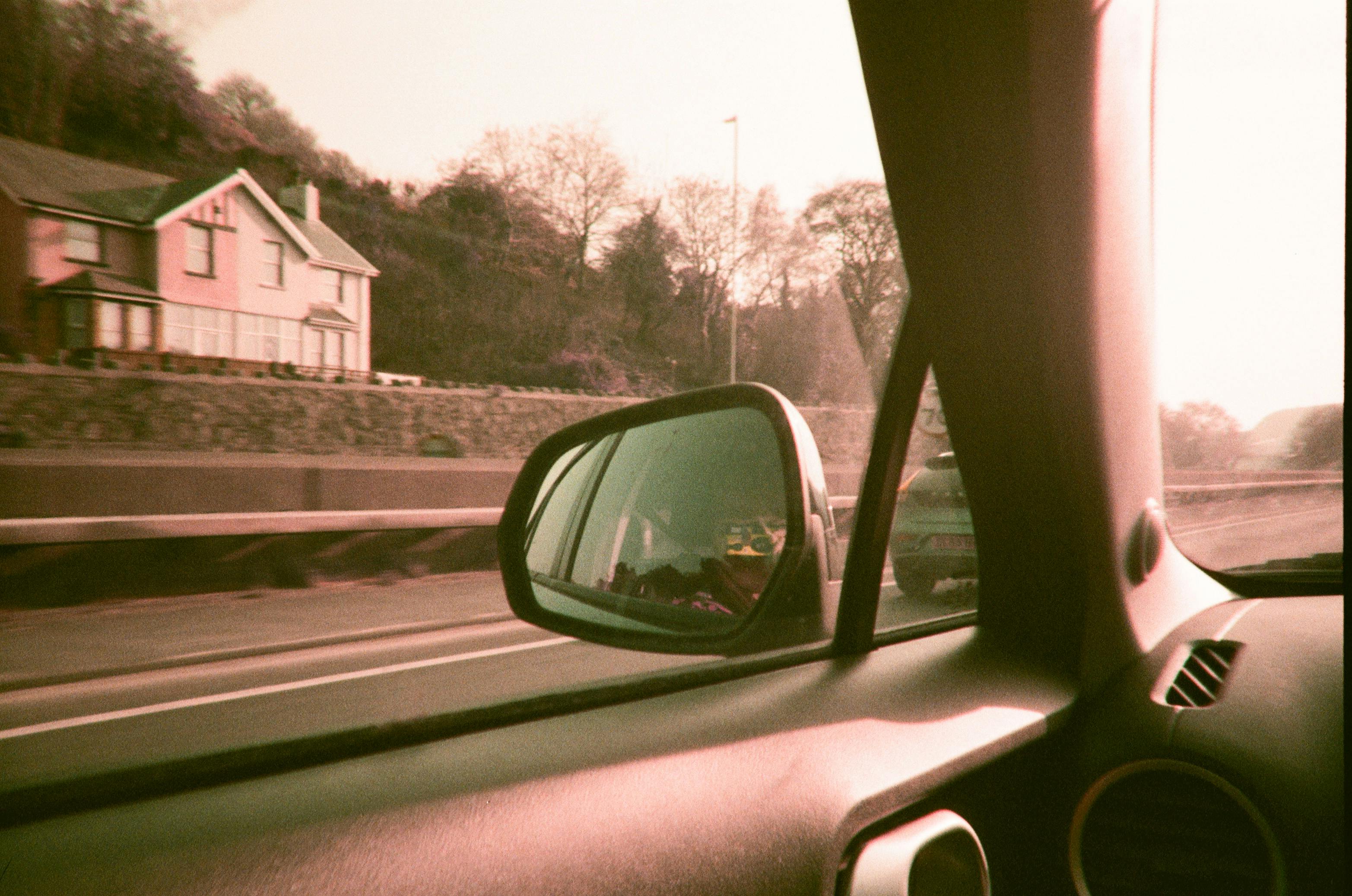 The Side Mirror of a Moving Car · Free Stock Photo
