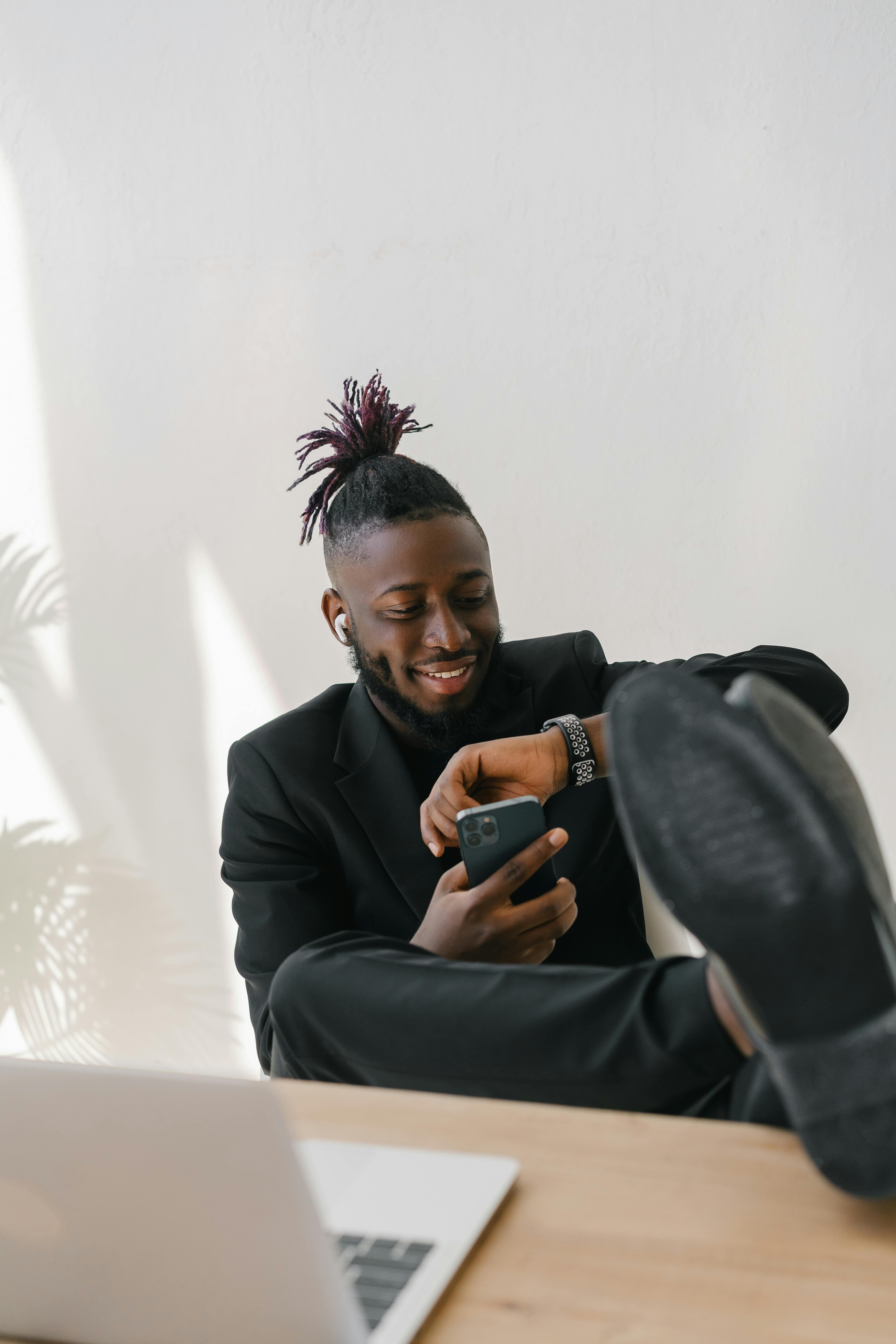 Smiling Man looking at his Watch · Free Stock Photo