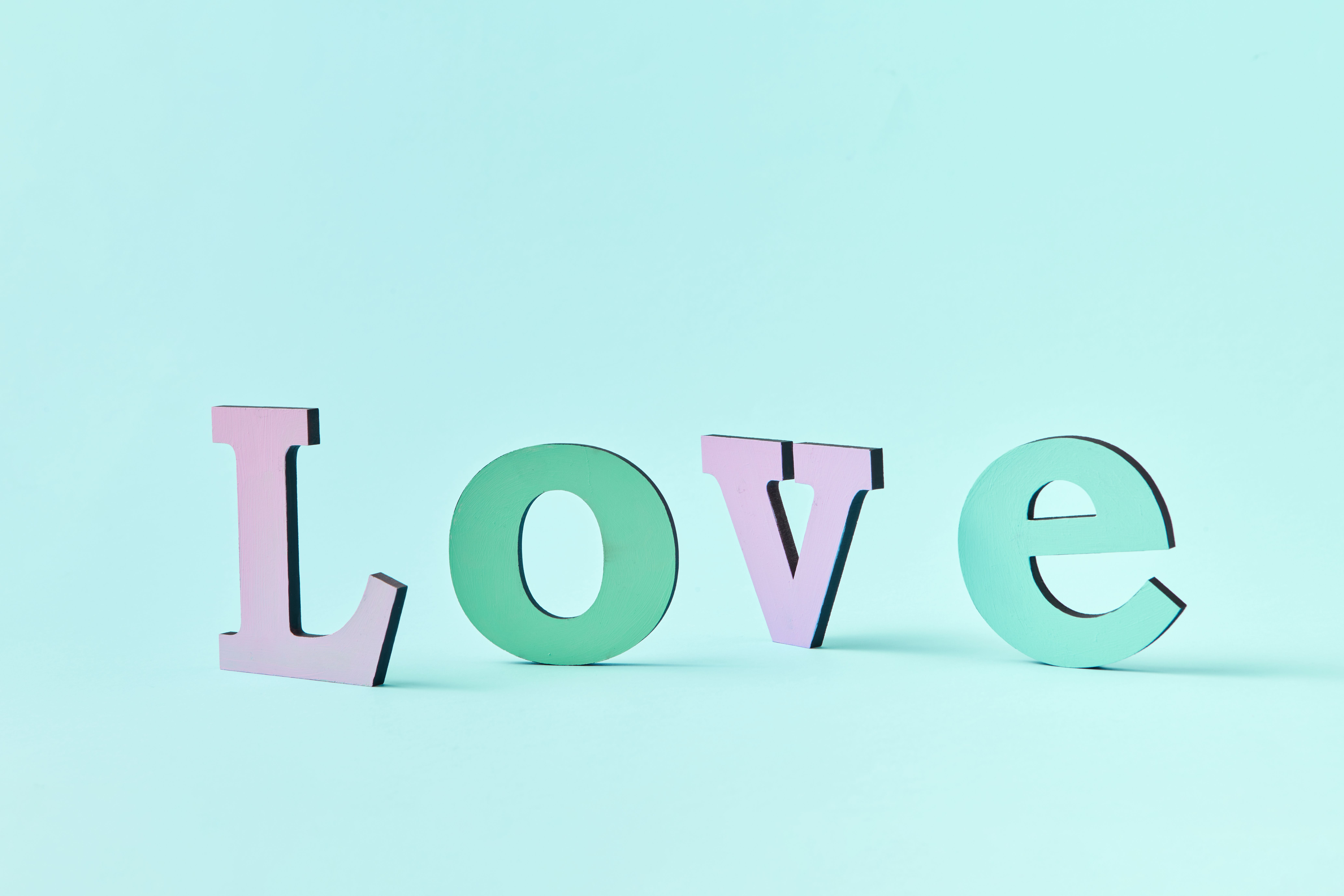 Letter Cutouts on a Blue Surface · Free Stock Photo