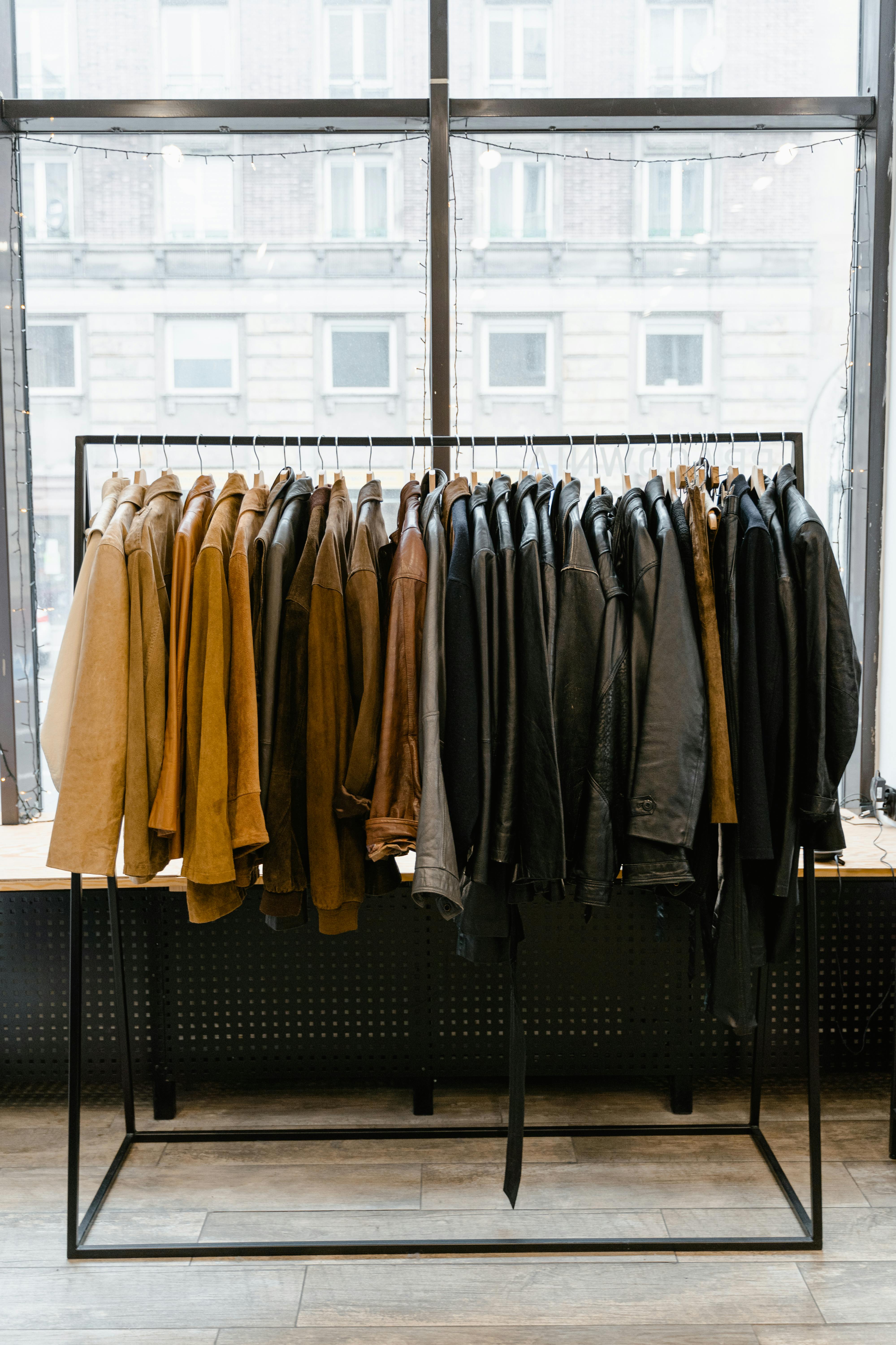Jackets Hanging on Black Clothes Rack · Free Stock Photo