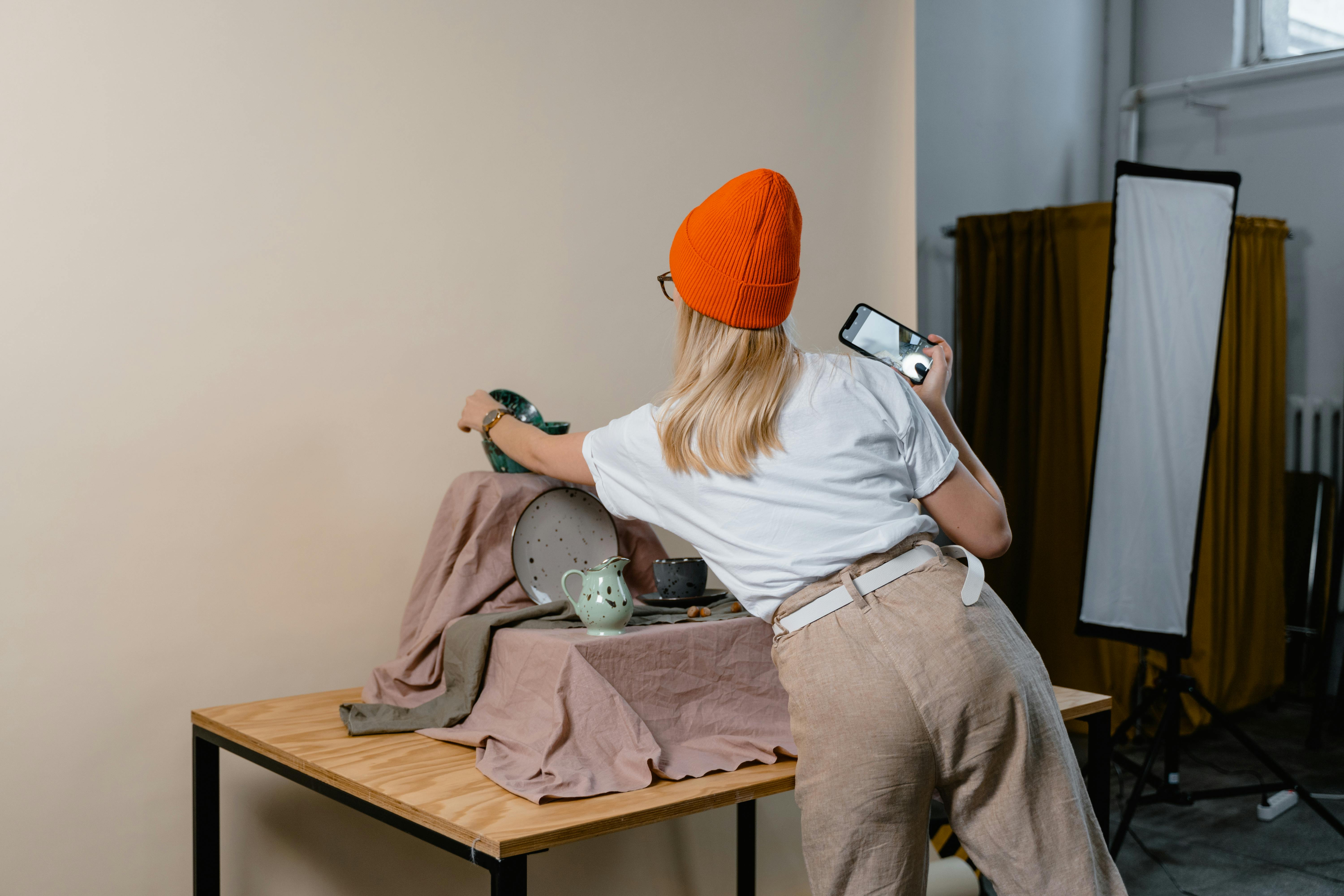 A Woman Setting Up the Silverware on the Platform · Free Stock Photo
