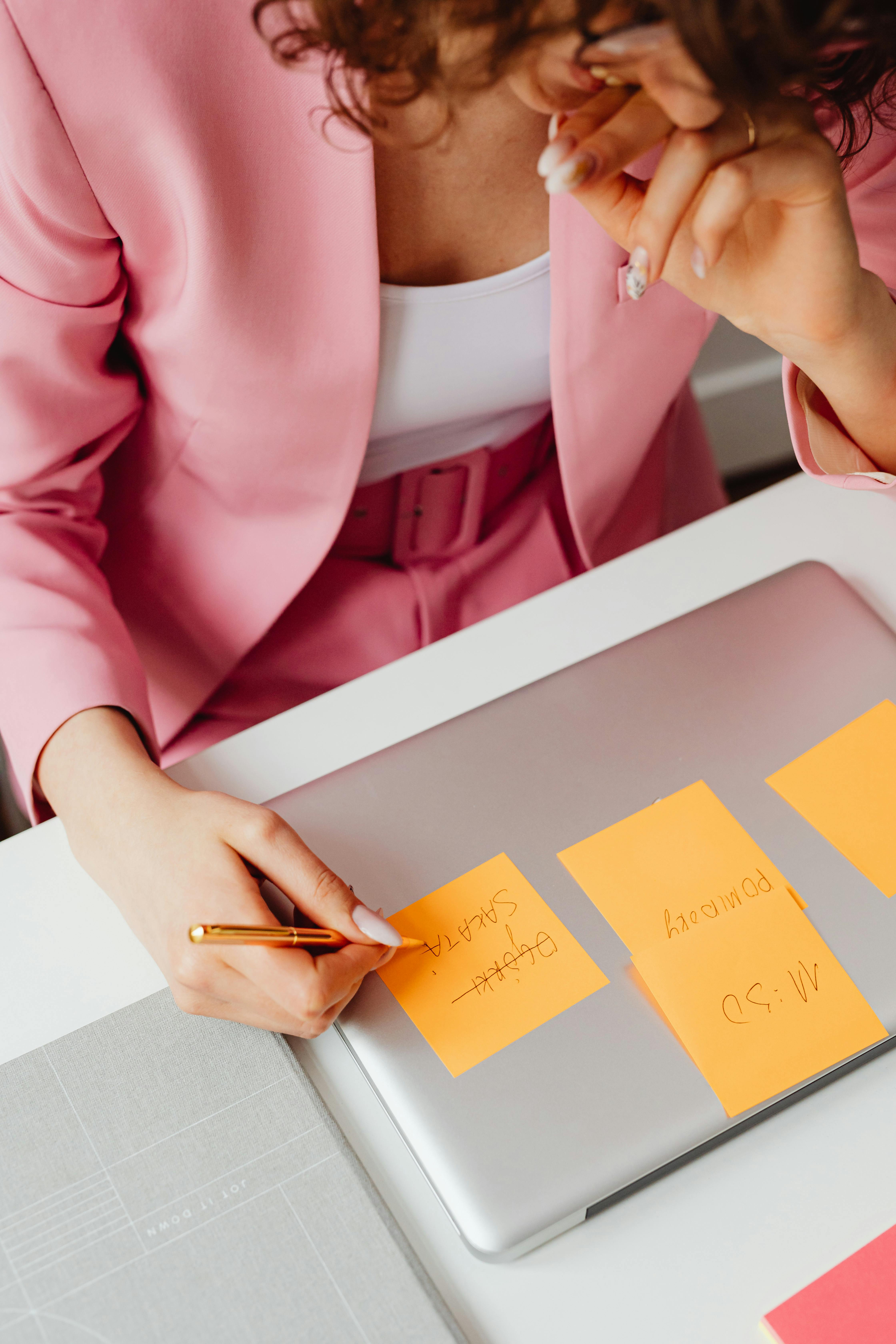 Woman in Pink Blazer Holding Sticky Notes · Free Stock Photo