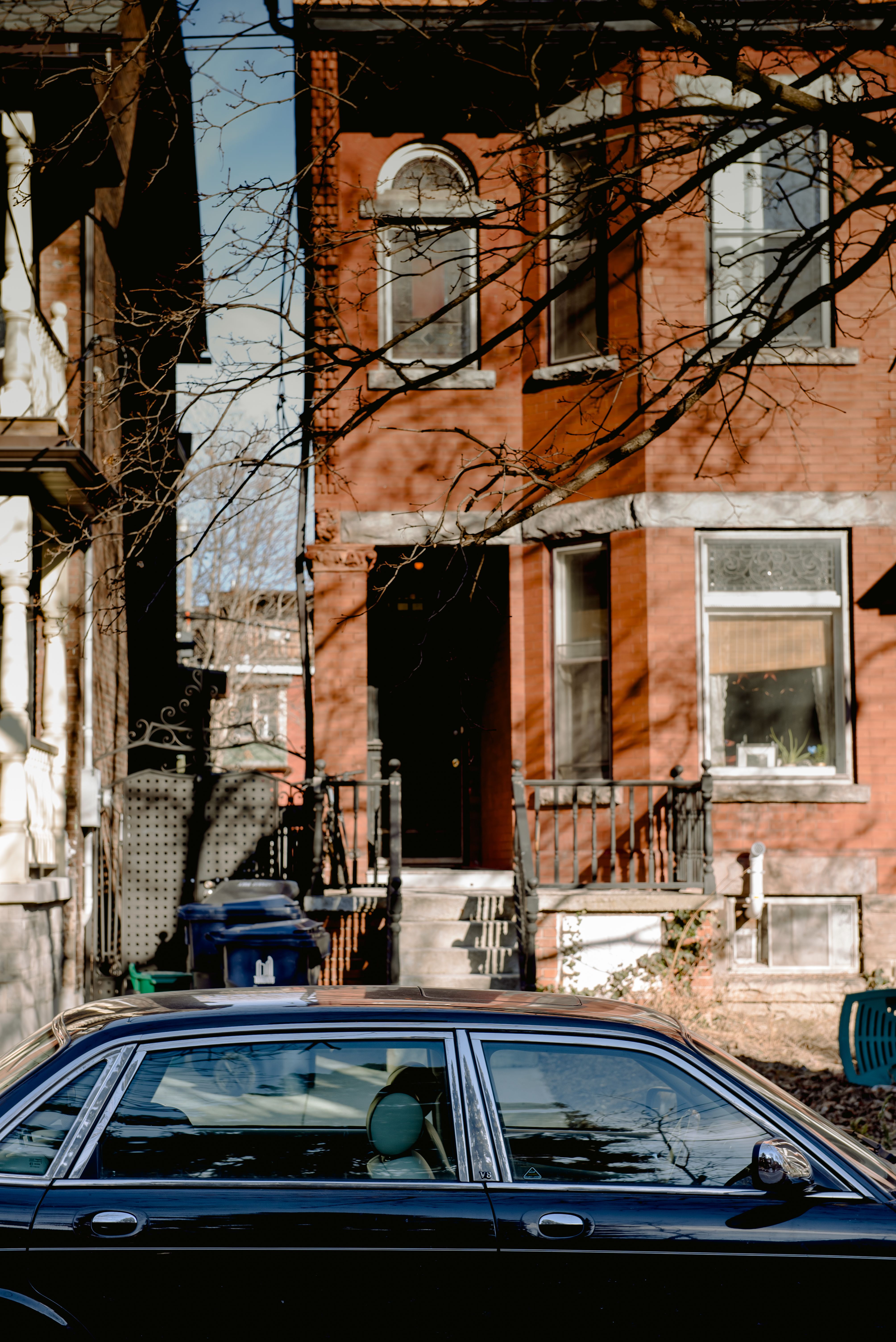 Photo of a Car Near a Building · Free Stock Photo