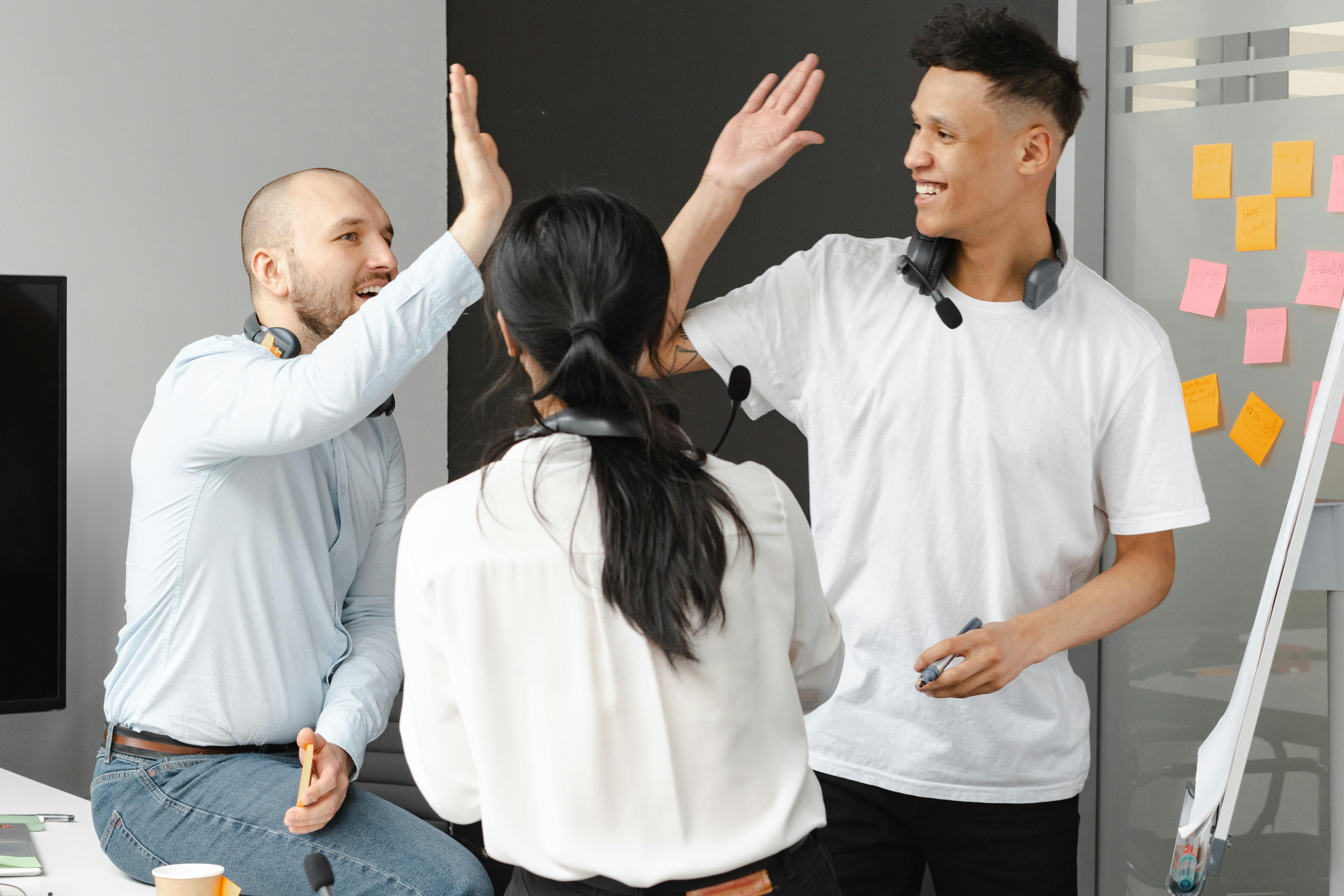 Men Doing a High five · Free Stock Photo