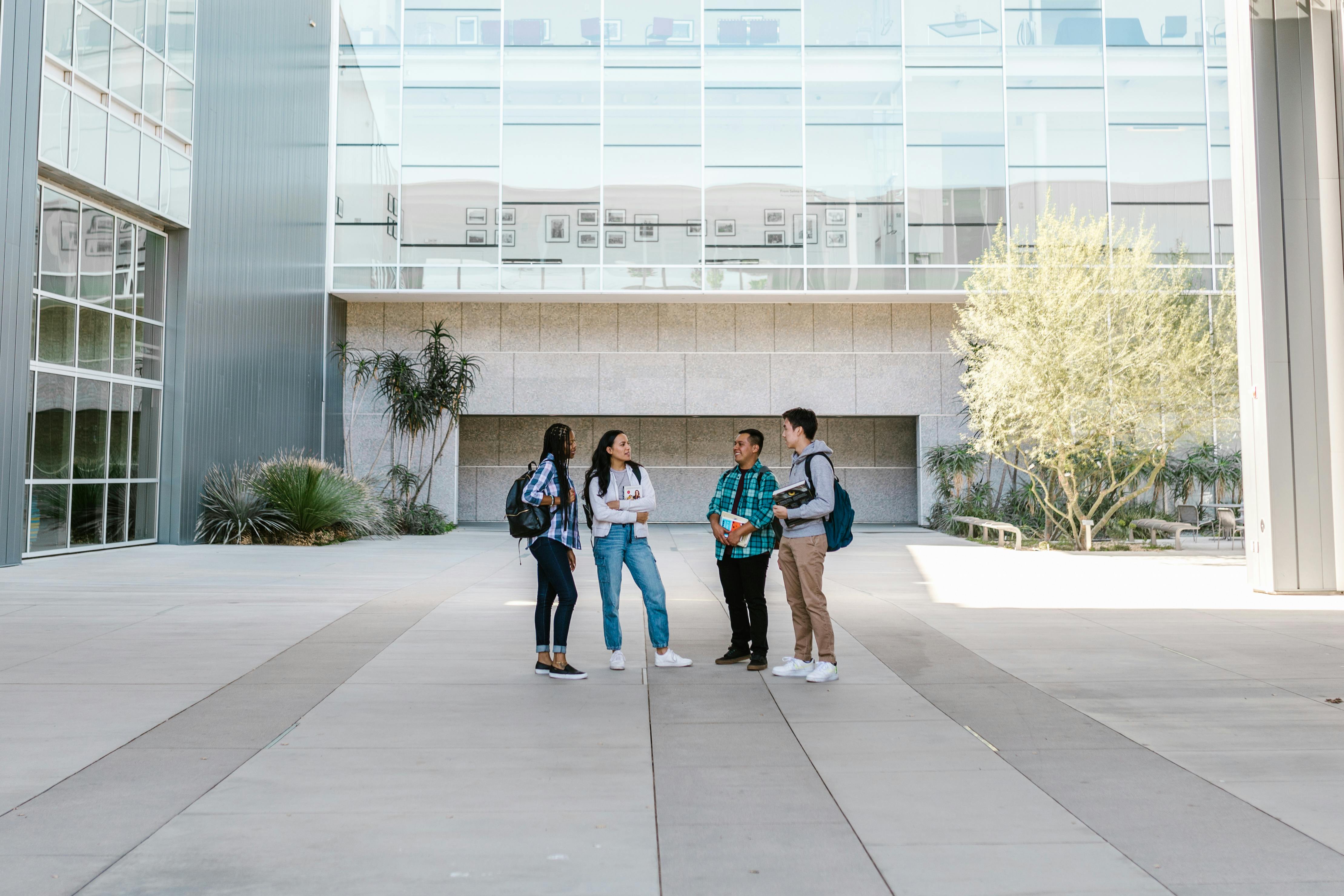 Three friends choosing VHS movie · Free Stock Photo