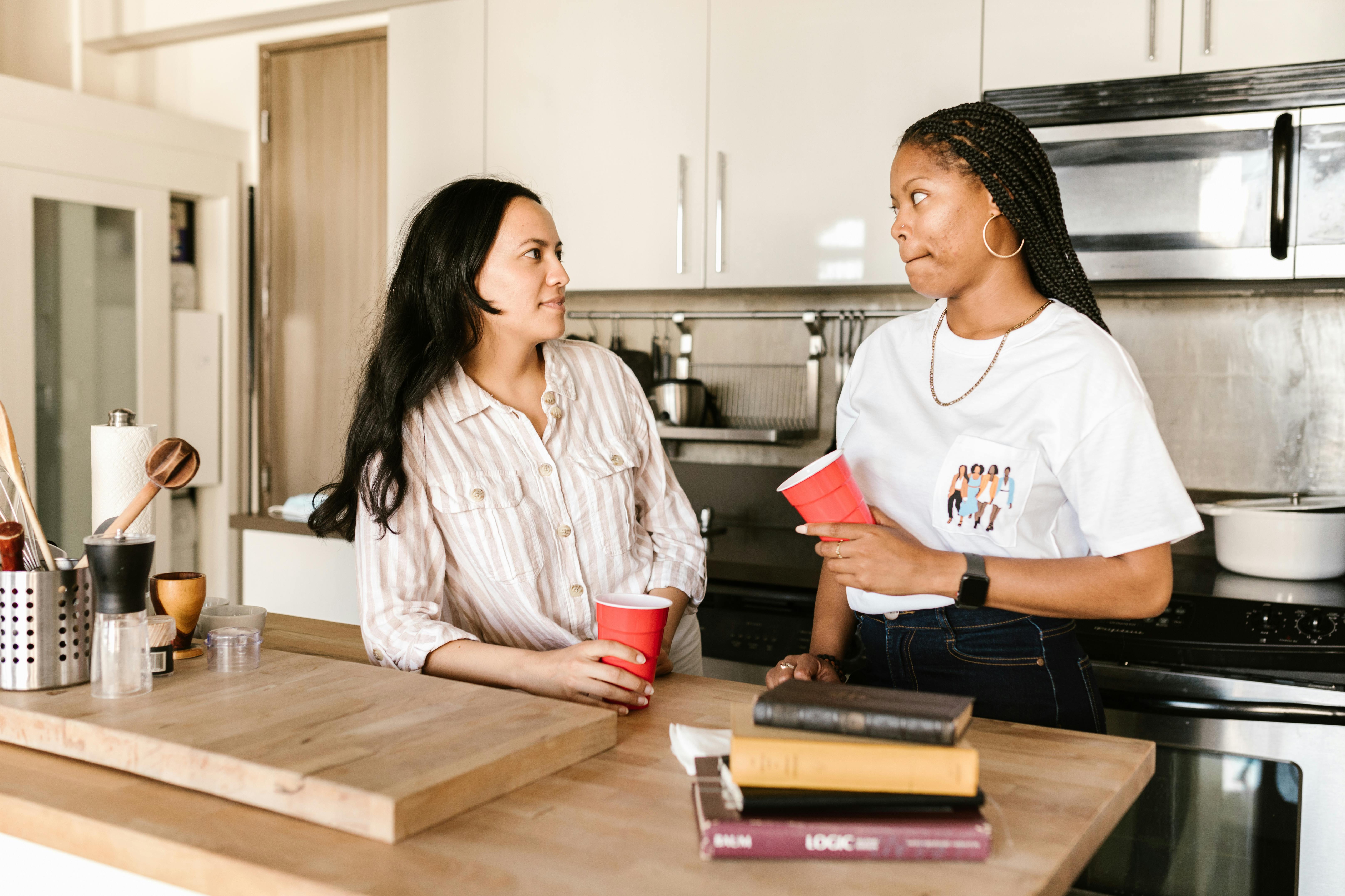 Two Women Talking In A Kitchen Photos, Download The BEST Free Two Women ...